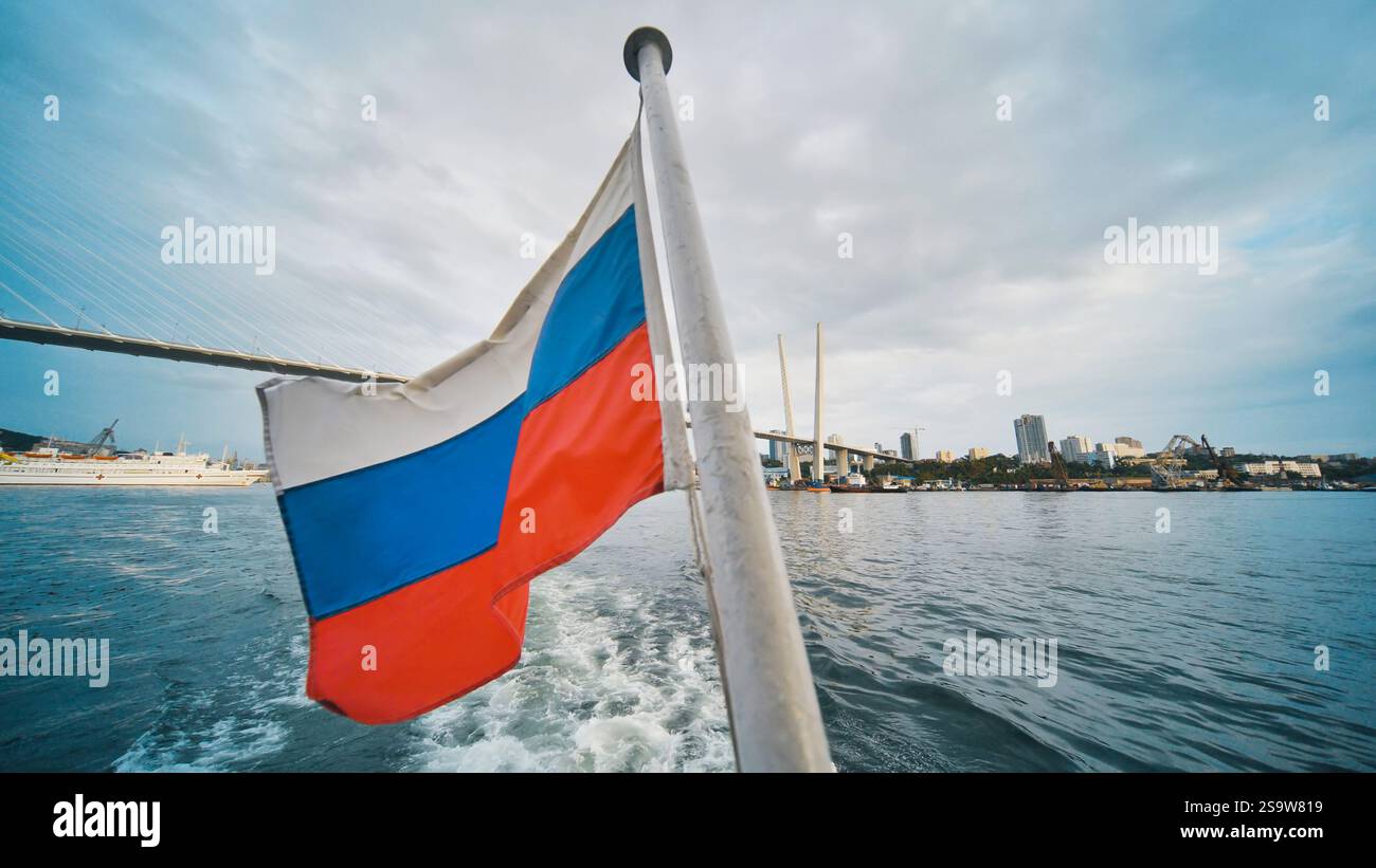 Russian flag waving from boat sailing in the eastern golden horn bay ...