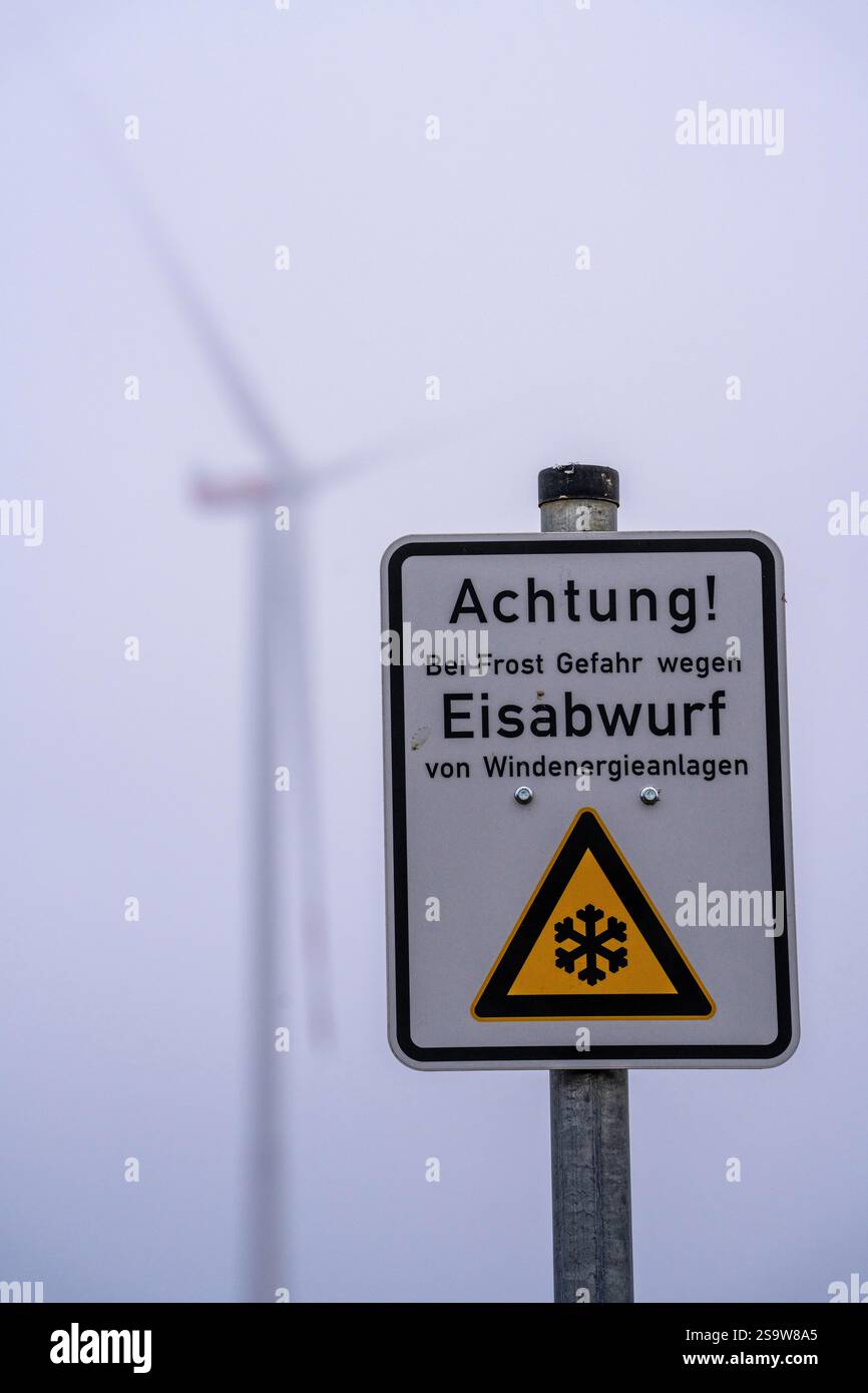 Sign warns of ice being dropped by wind turbines. Ice can form on the ...