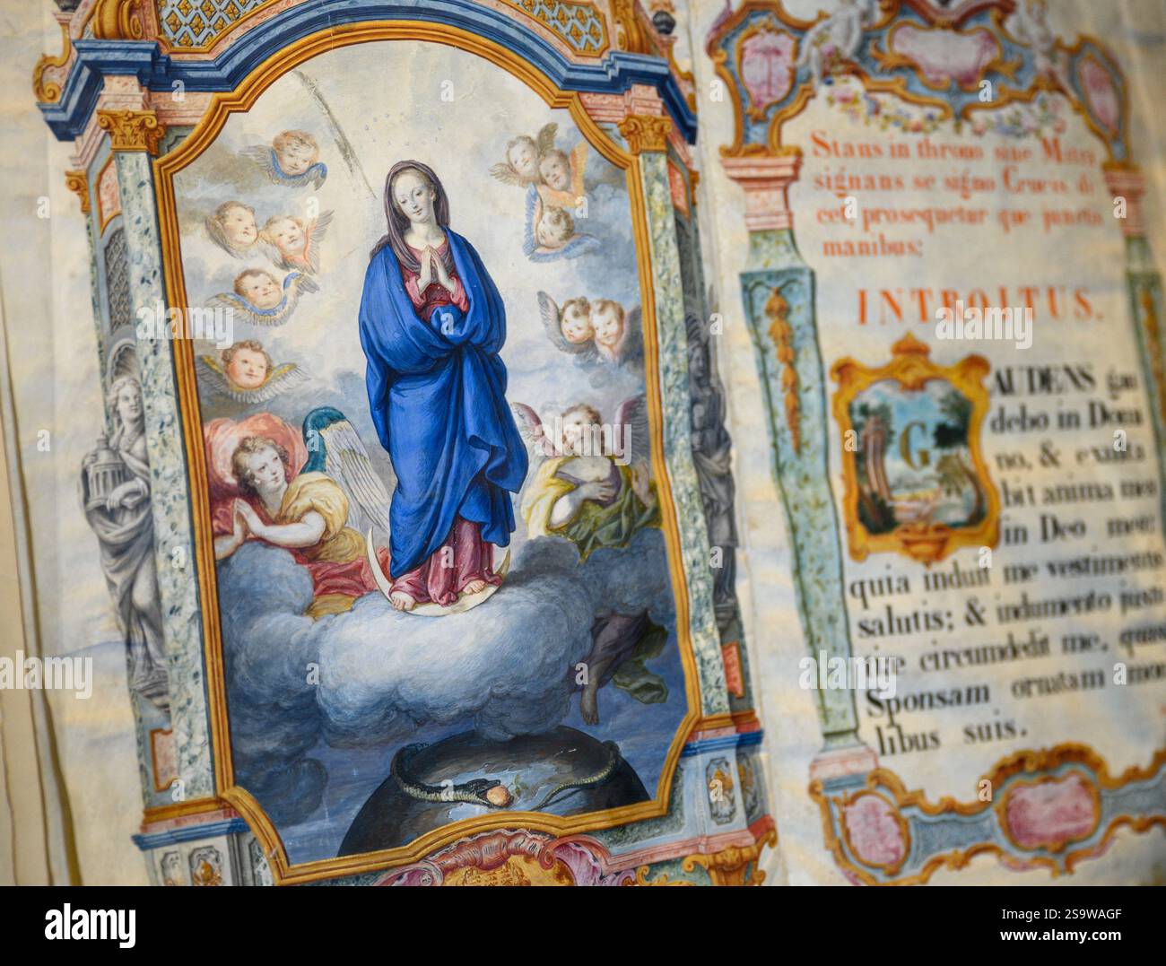 A liturgical book with an image of the Virgin Mary with angels. The ...