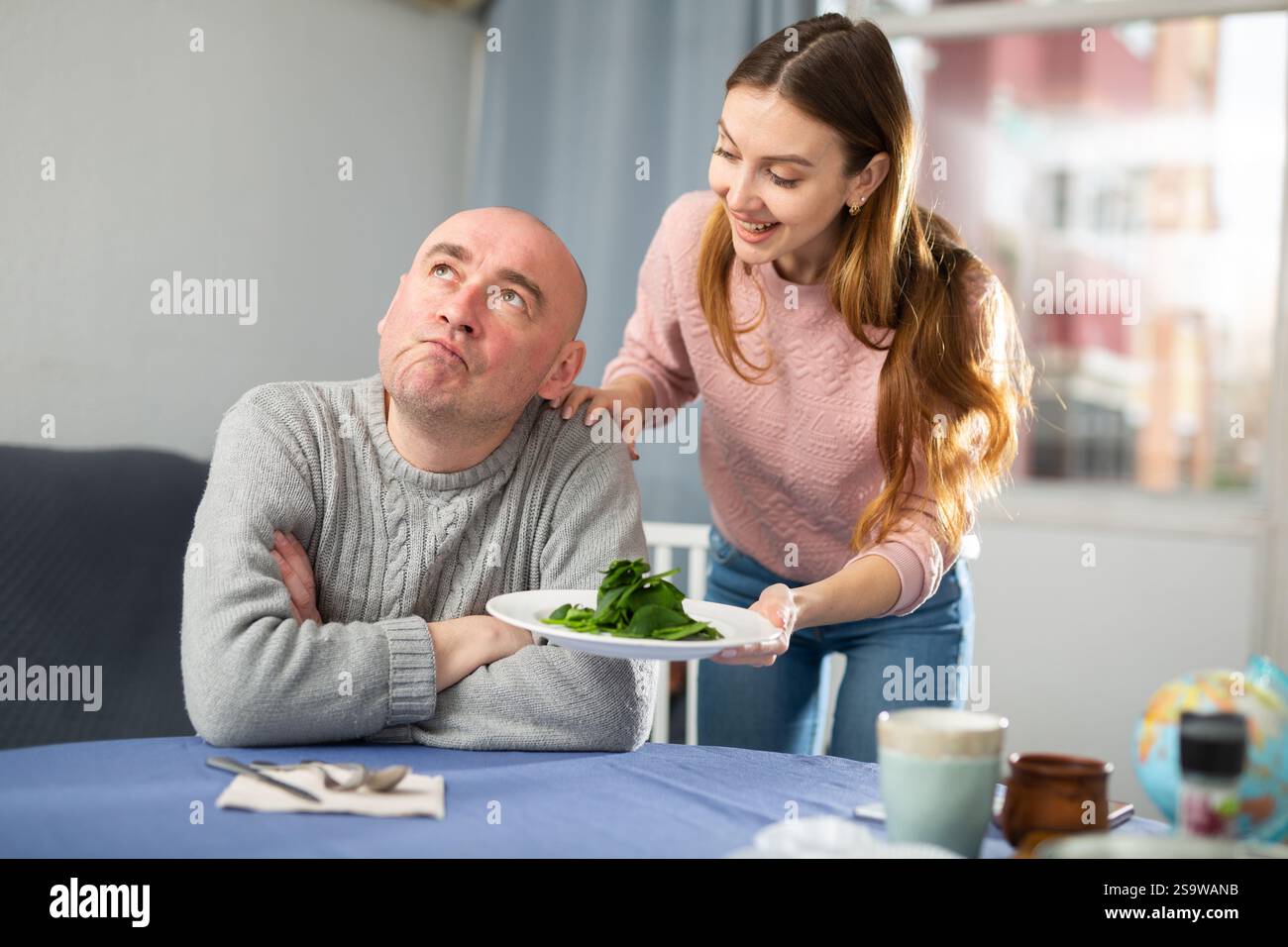 Man dissatisfied by dinner made by his wife Stock Photo - Alamy