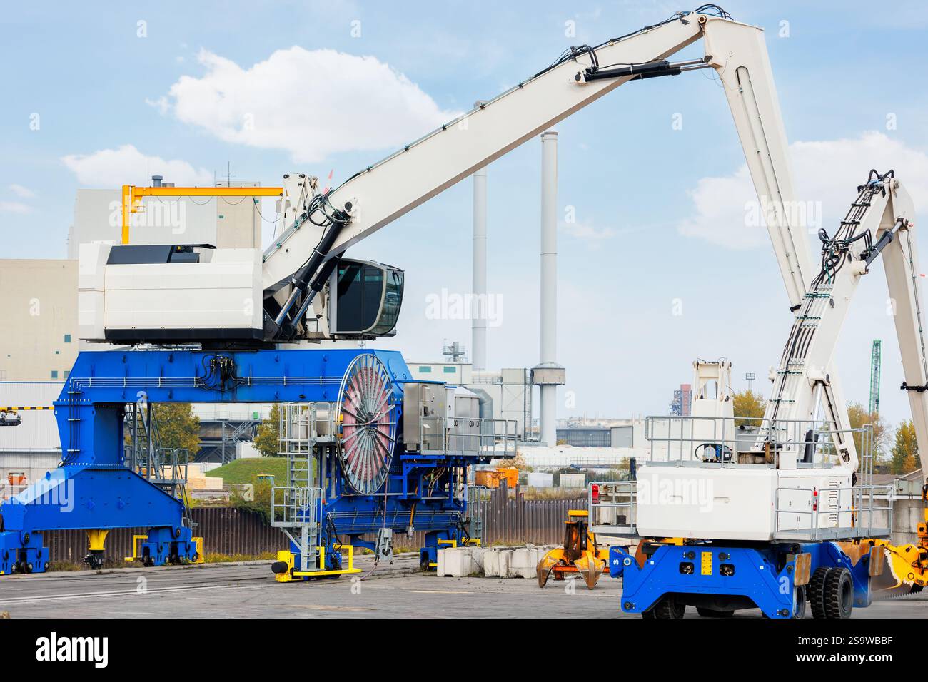 Waste disposal metal recycling site facility gigantic crane stands in ...