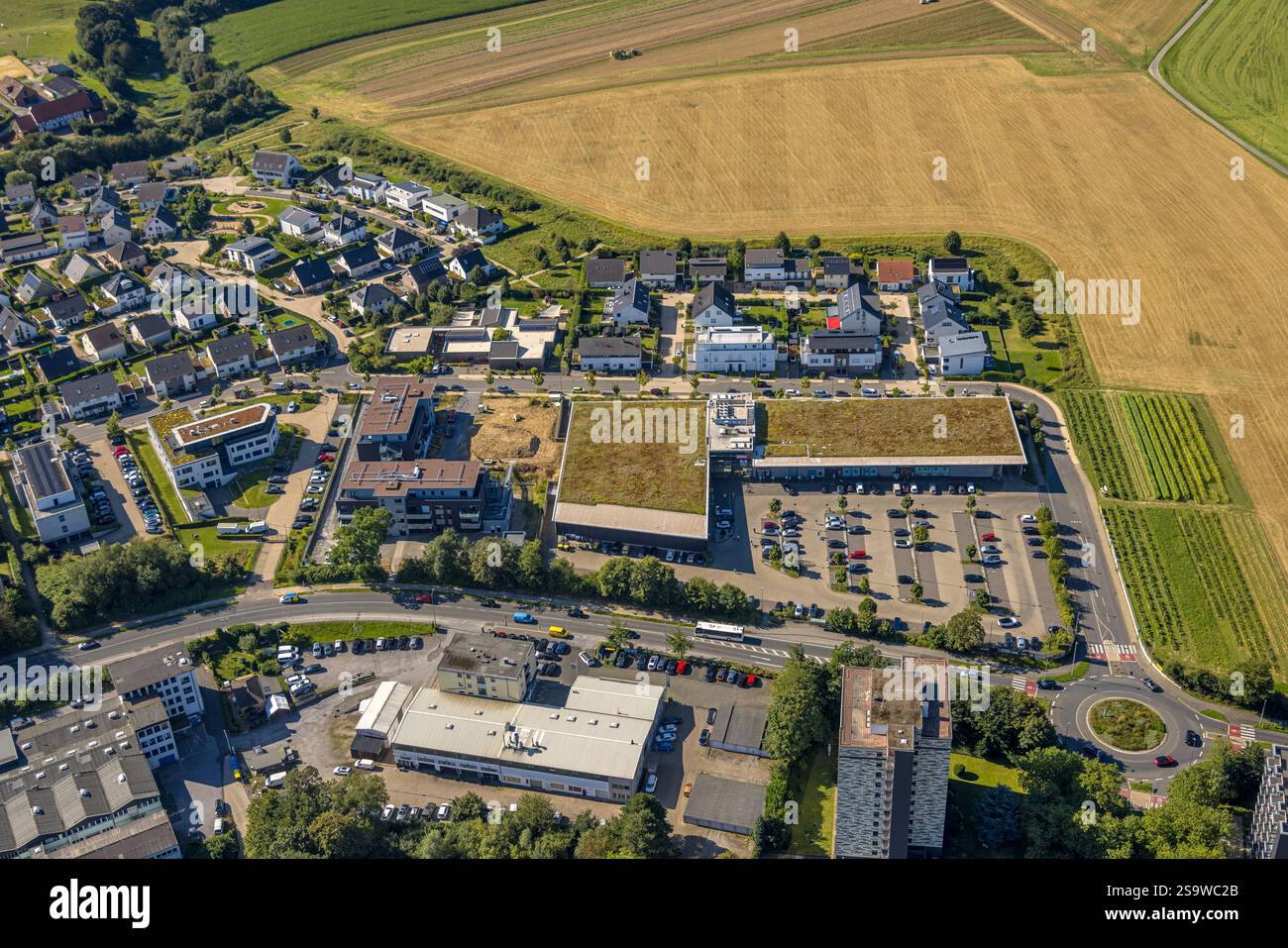 Aerial View Shopping Center With Supermarket Rewe And Aldi H seler aerial-view-shopping-center-with-supermarket-rewe-and-aldi-h-seler