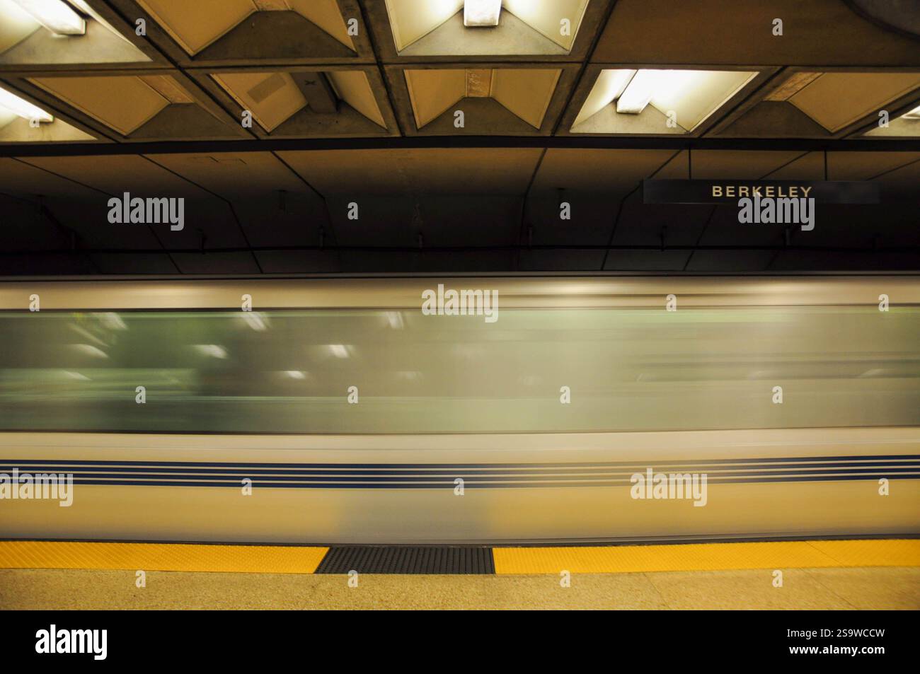 Blurred train passing Berkeley station, capturing urban transit energy ...