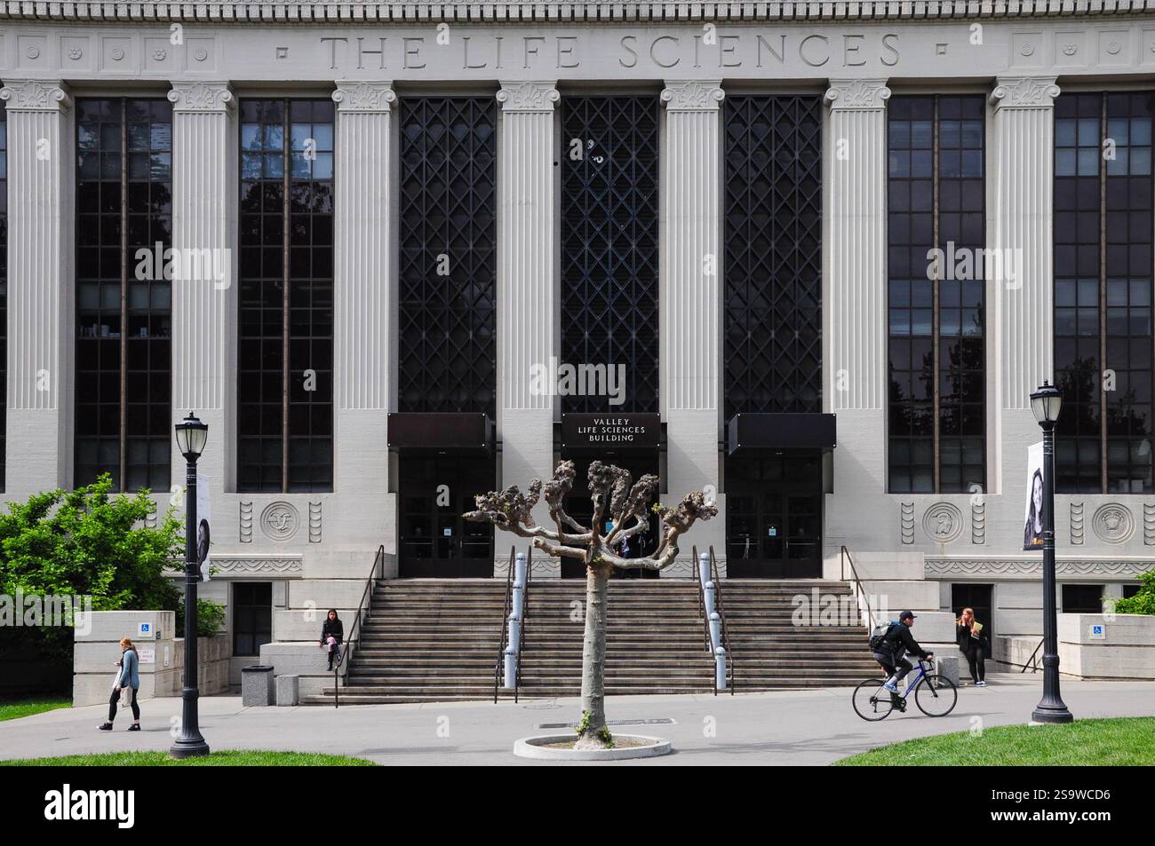Students and cyclists at the iconic Life Sciences Building on campus ...