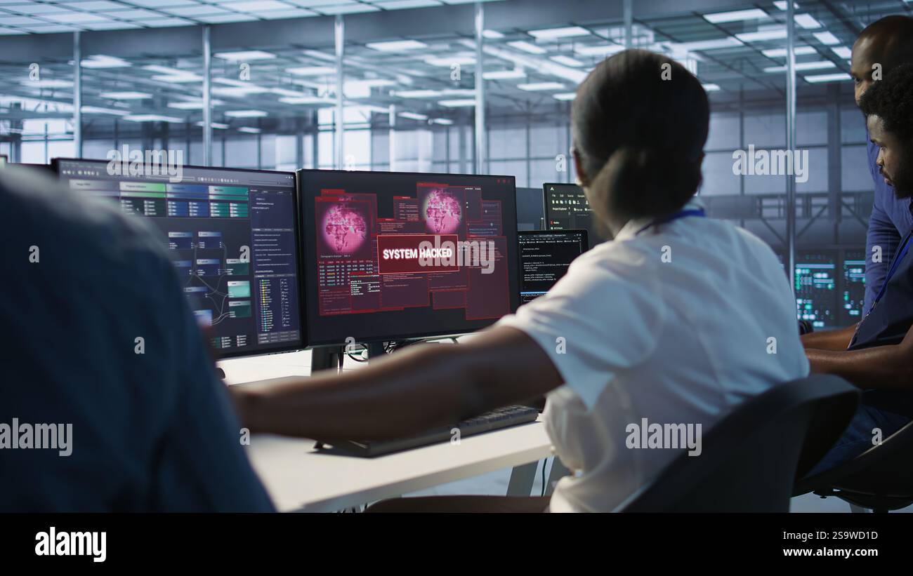 Team Of Engineers In Server Hub Trying To Protect Gear From Hacker Stealing Sensitive