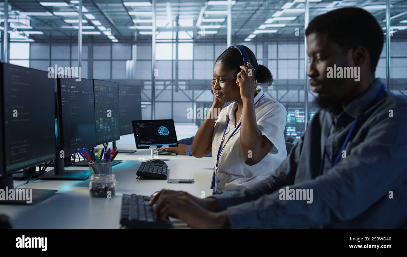 Engineer arriving in data center, saluting colleagues, starting ...