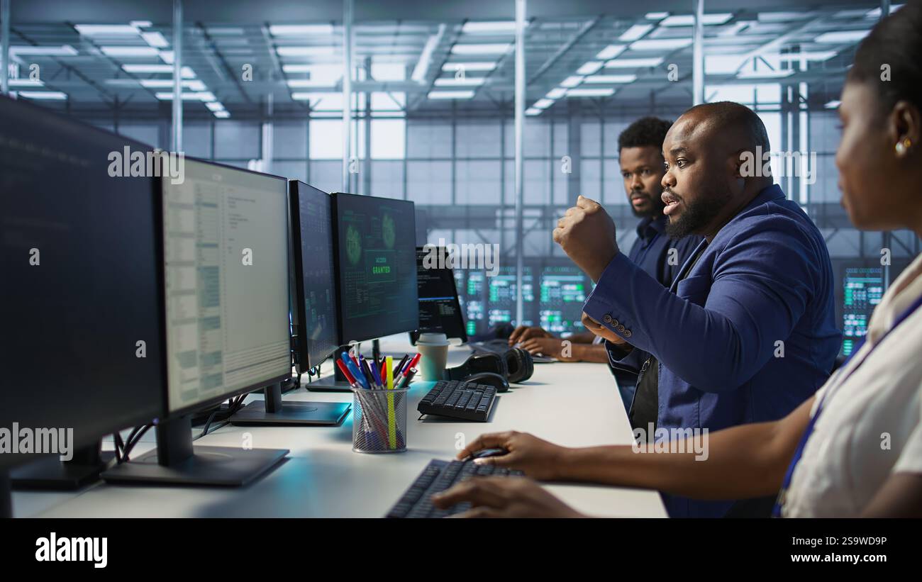 Surprised data center technician celebrating after successfully ...