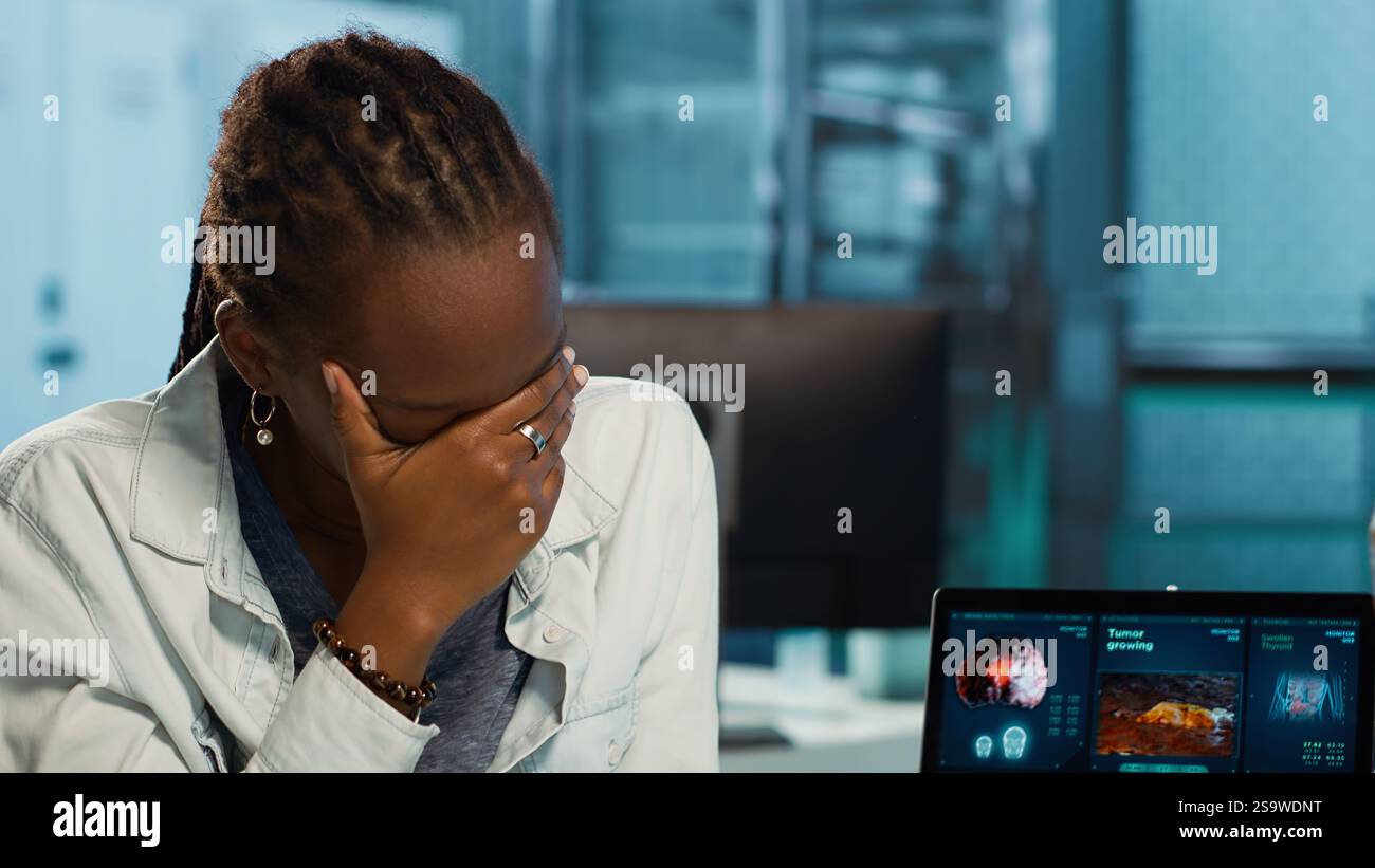 African american female doctor discussing a scary cancer diagnosis with ...