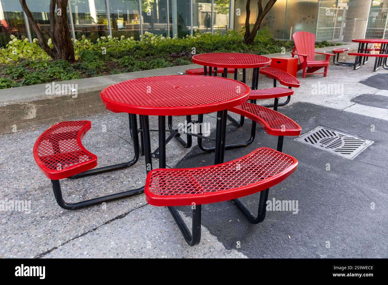 Red outdoor table with benches near office building in Sparks street in ...