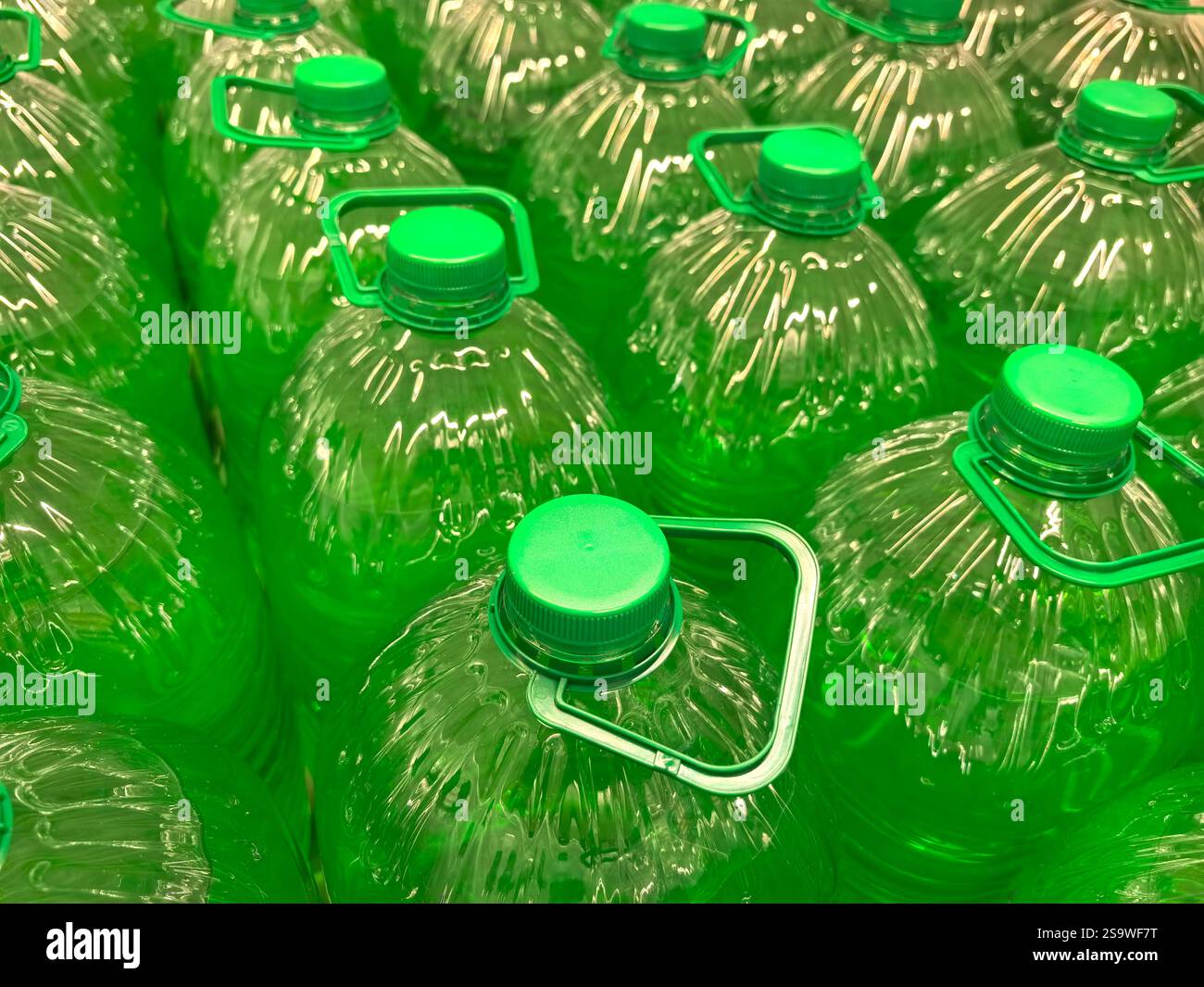 Vibrant green bottles with unique handles fill the shelves, glistening ...