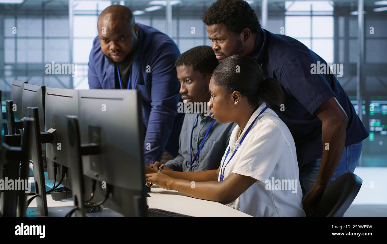 Coworkers in data center doing brainstorming, implementing AI predictive maintenance systems ...