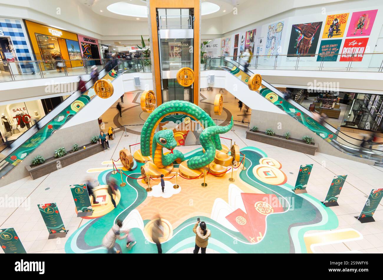 Toronto, Canada. 27th Jan, 2025. People view a snake installation at a ...