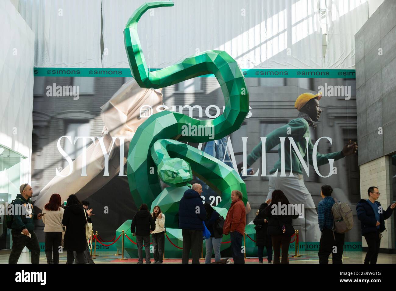Toronto, Canada. 27th Jan, 2025. People view a snake installation at a ...