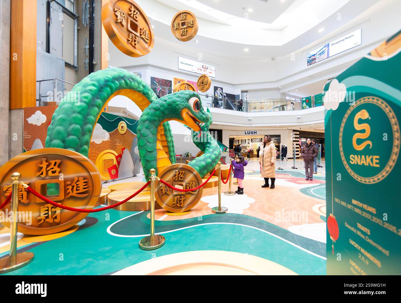 Toronto, Canada. 27th Jan, 2025. People view a snake installation at a ...