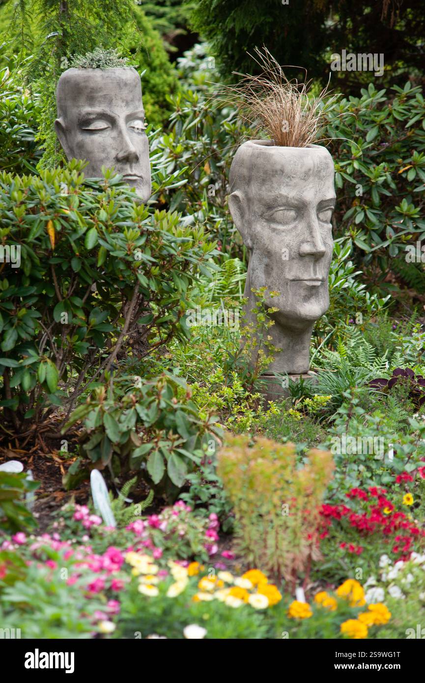 Garden Planters Shaped like Human Heads with Flowers Stock Photo - Alamy