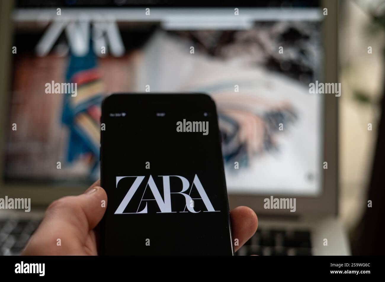 Zara logo on the screen of mobile phone. Fast fashion industry Stock ...