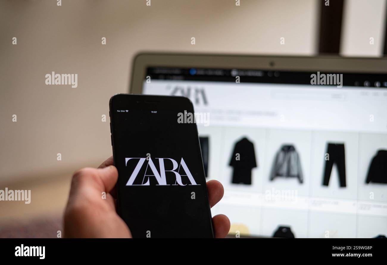 Zara logo on the screen of mobile phone. Fast fashion industry Stock ...