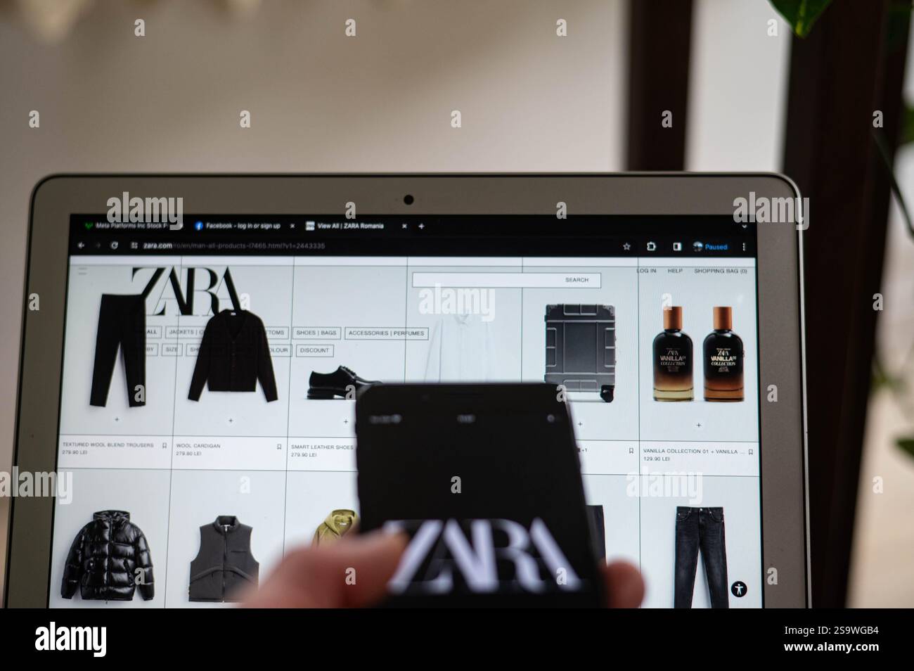 Zara logo on the screen of mobile phone. Fast fashion industry Stock ...
