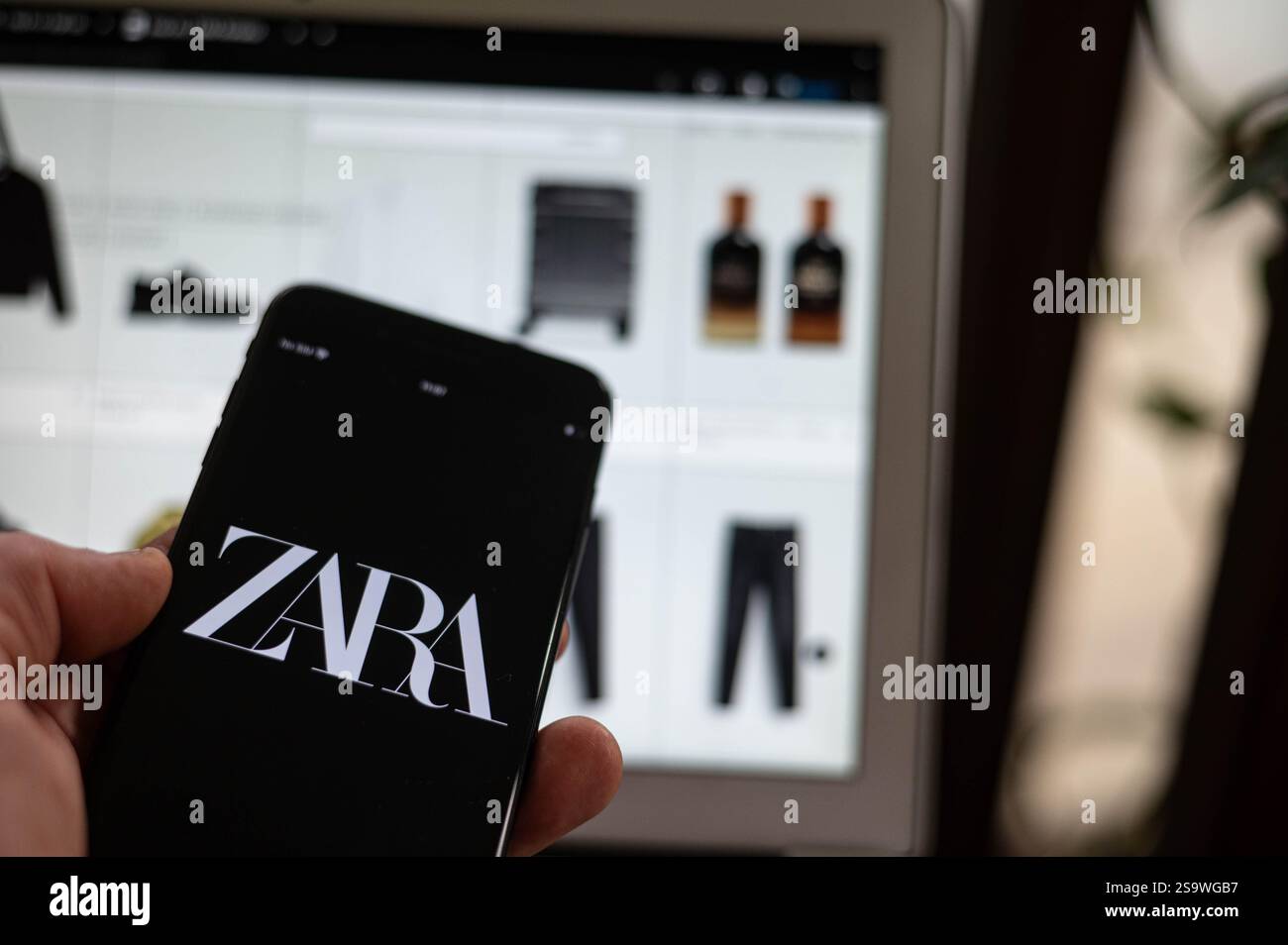Zara logo on the screen of mobile phone. Fast fashion industry Stock ...