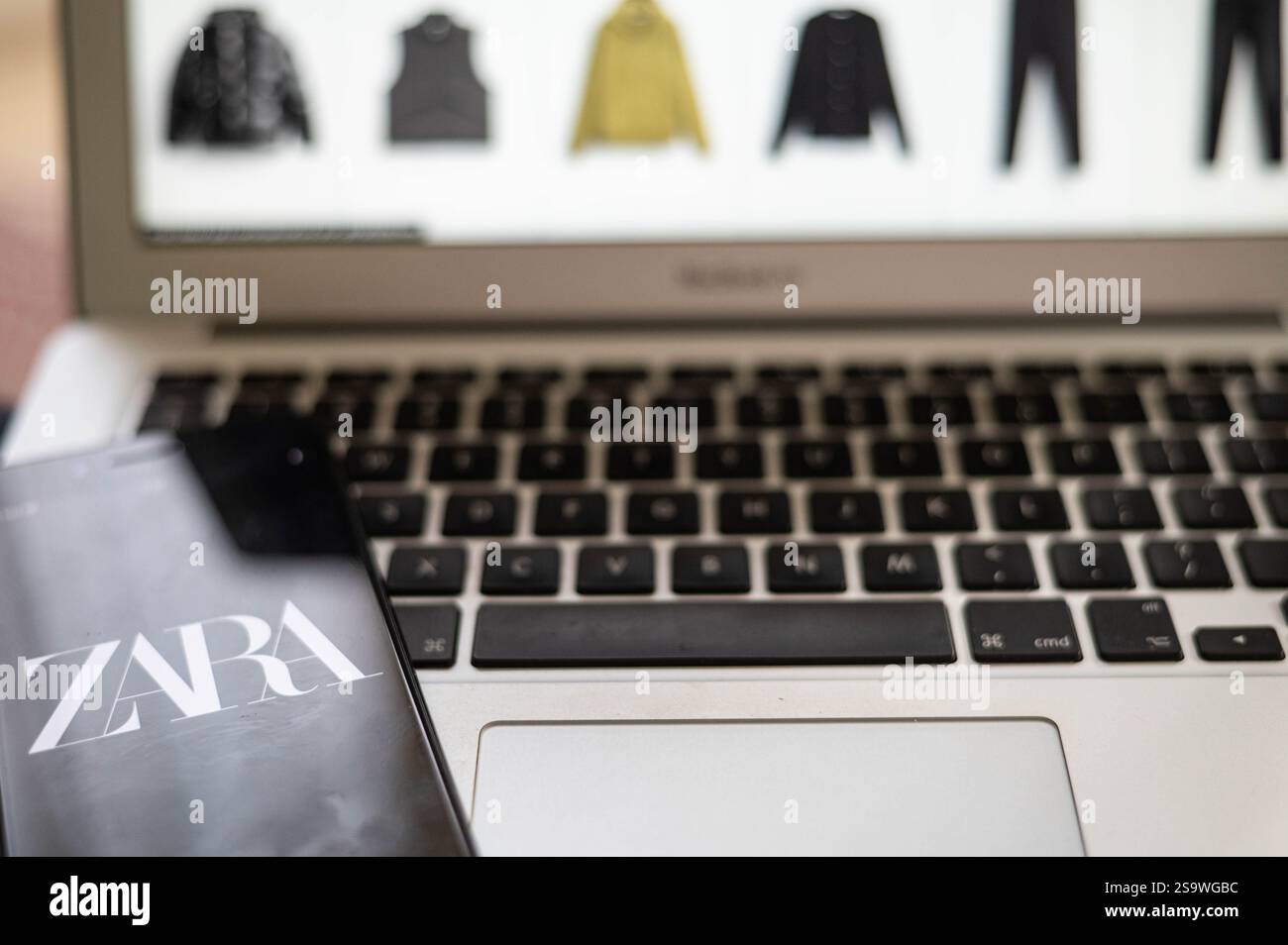 Zara logo on the screen of mobile phone. Fast fashion industry Stock ...