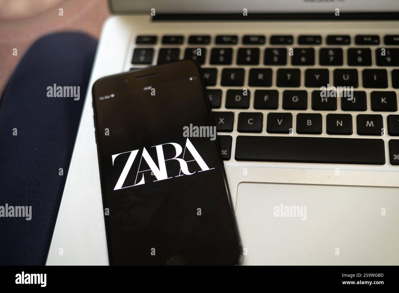 Zara logo on the screen of mobile phone. Fast fashion industry Stock ...