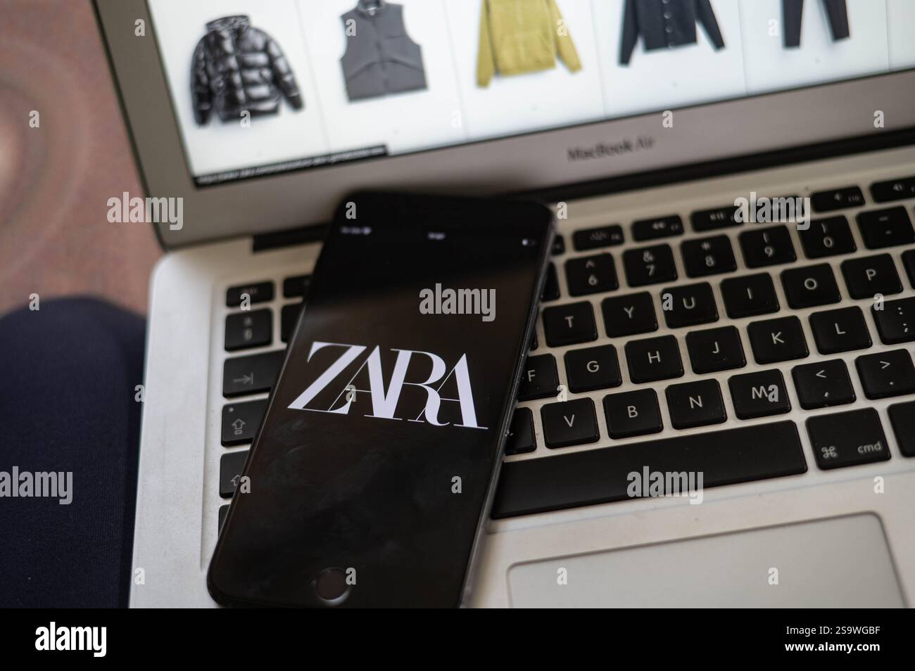 Zara logo on the screen of mobile phone. Fast fashion industry Stock ...