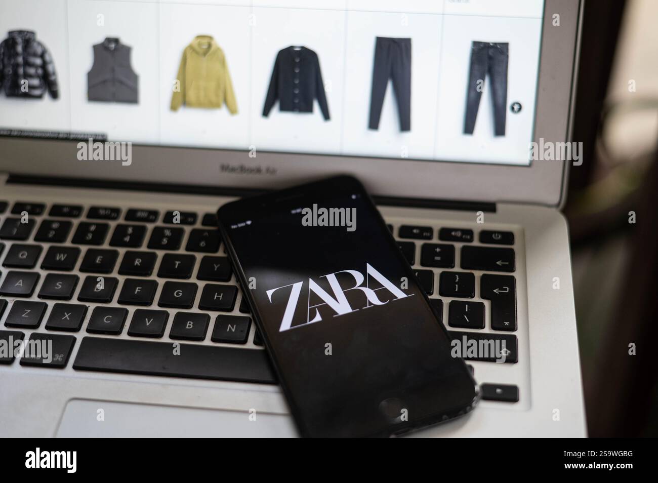 Zara logo on the screen of mobile phone. Fast fashion industry Stock ...