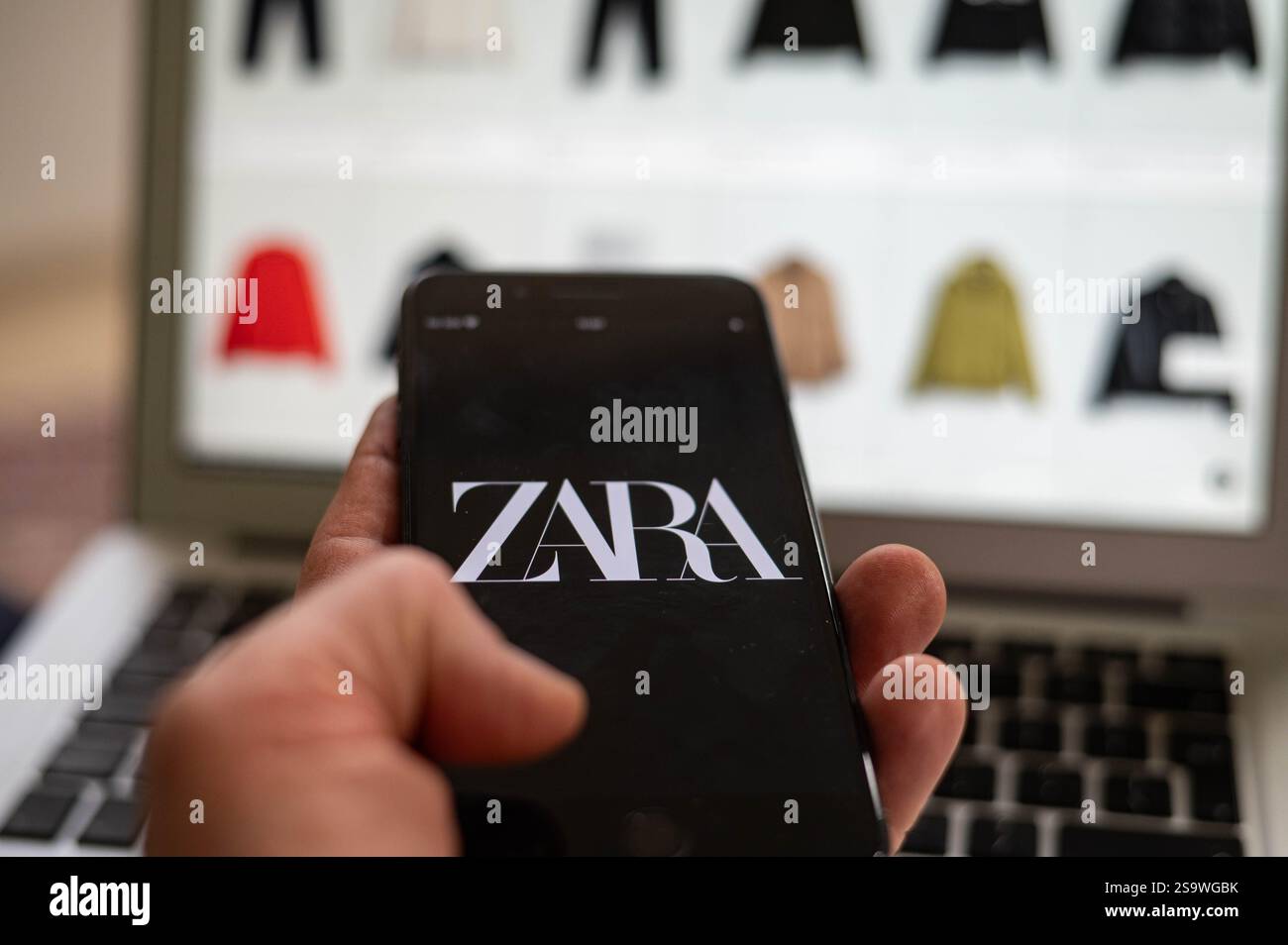 Zara logo on the screen of mobile phone. Fast fashion industry Stock ...