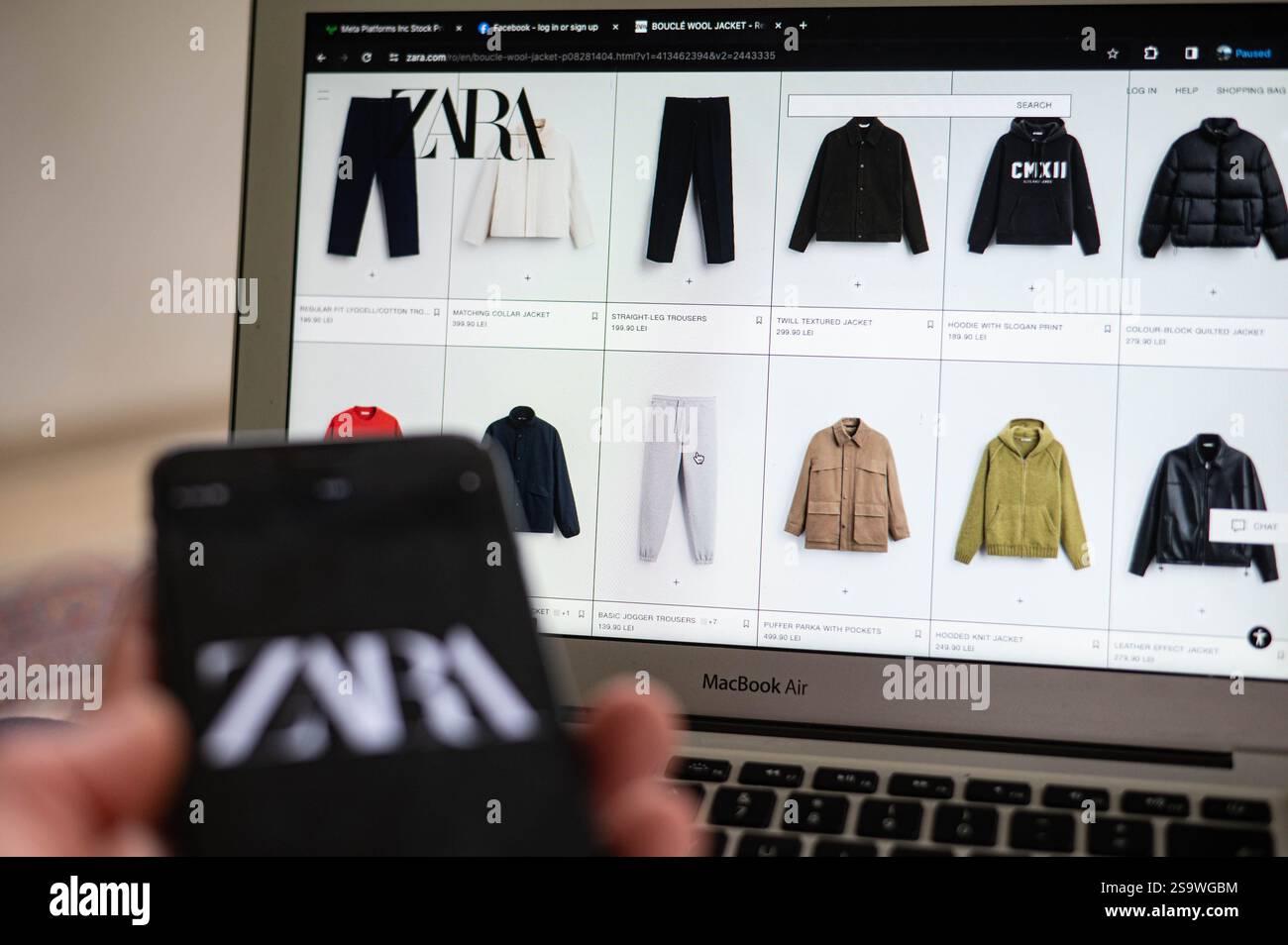 Zara logo on the screen of mobile phone. Fast fashion industry Stock ...