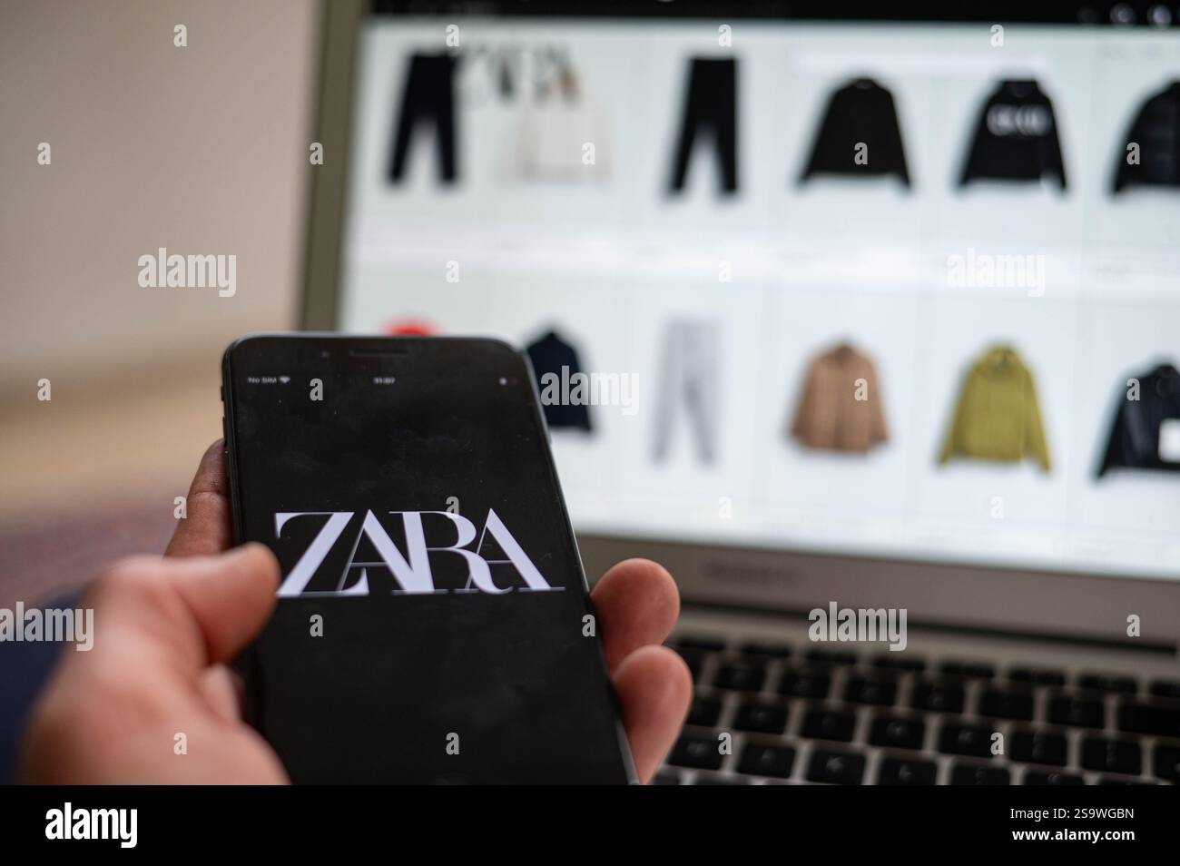 Zara logo on the screen of mobile phone. Fast fashion industry Stock ...