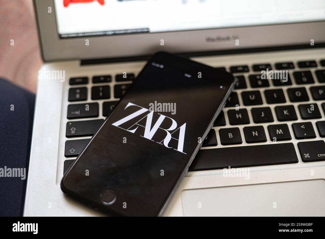 Zara logo on the screen of mobile phone. Fast fashion industry Stock ...