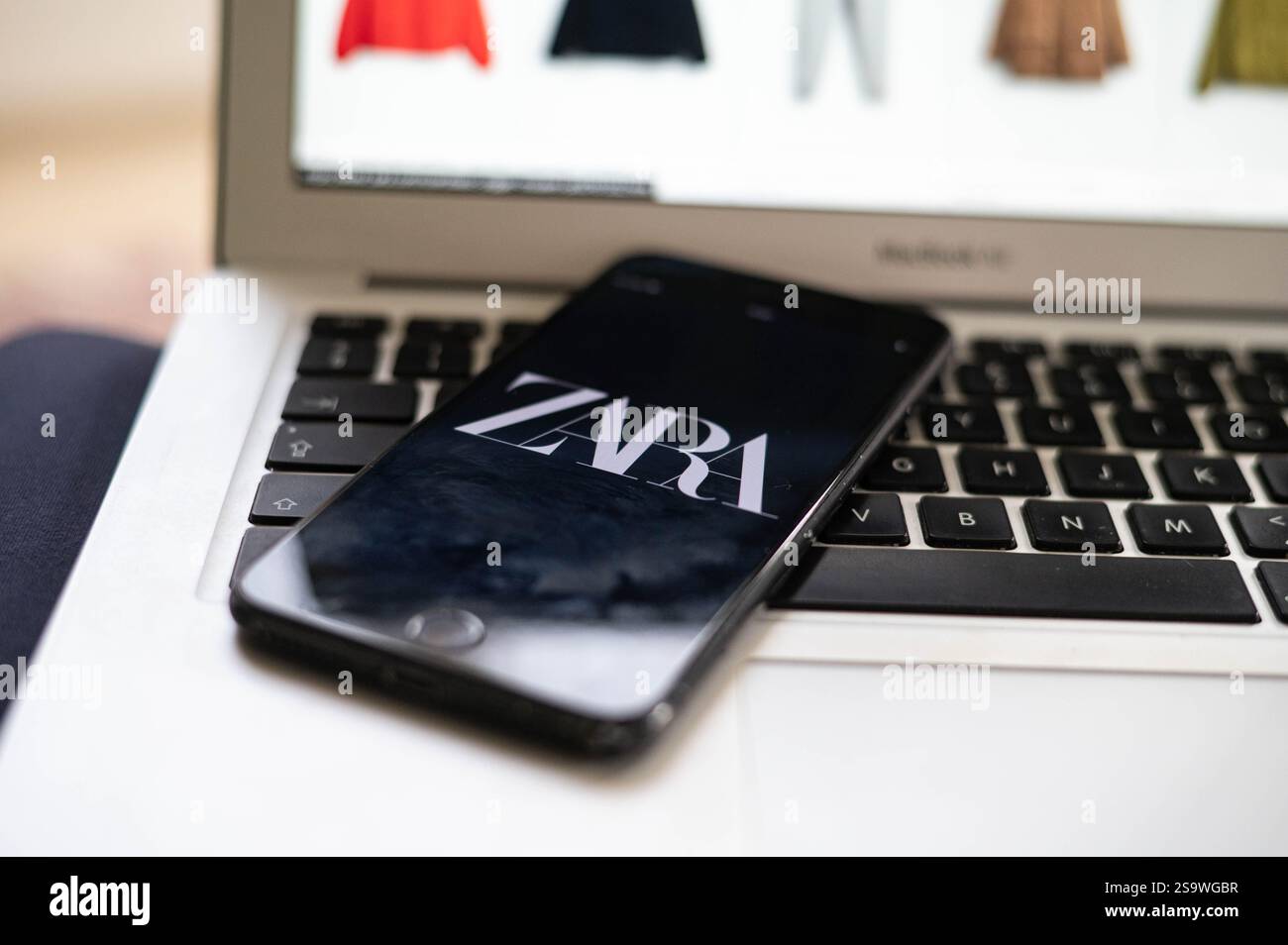 Zara logo on the screen of mobile phone. Fast fashion industry Stock ...