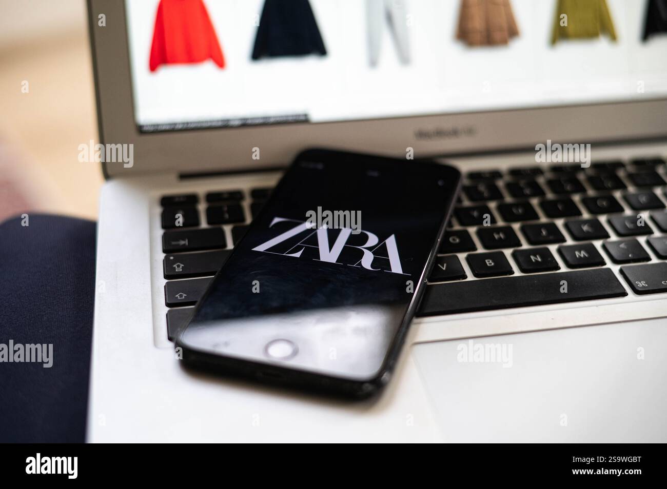 Zara logo on the screen of mobile phone. Fast fashion industry Stock ...