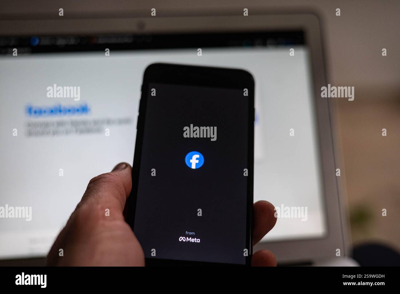 A person is opening Facebook app on a phone. Facebook social media app ...