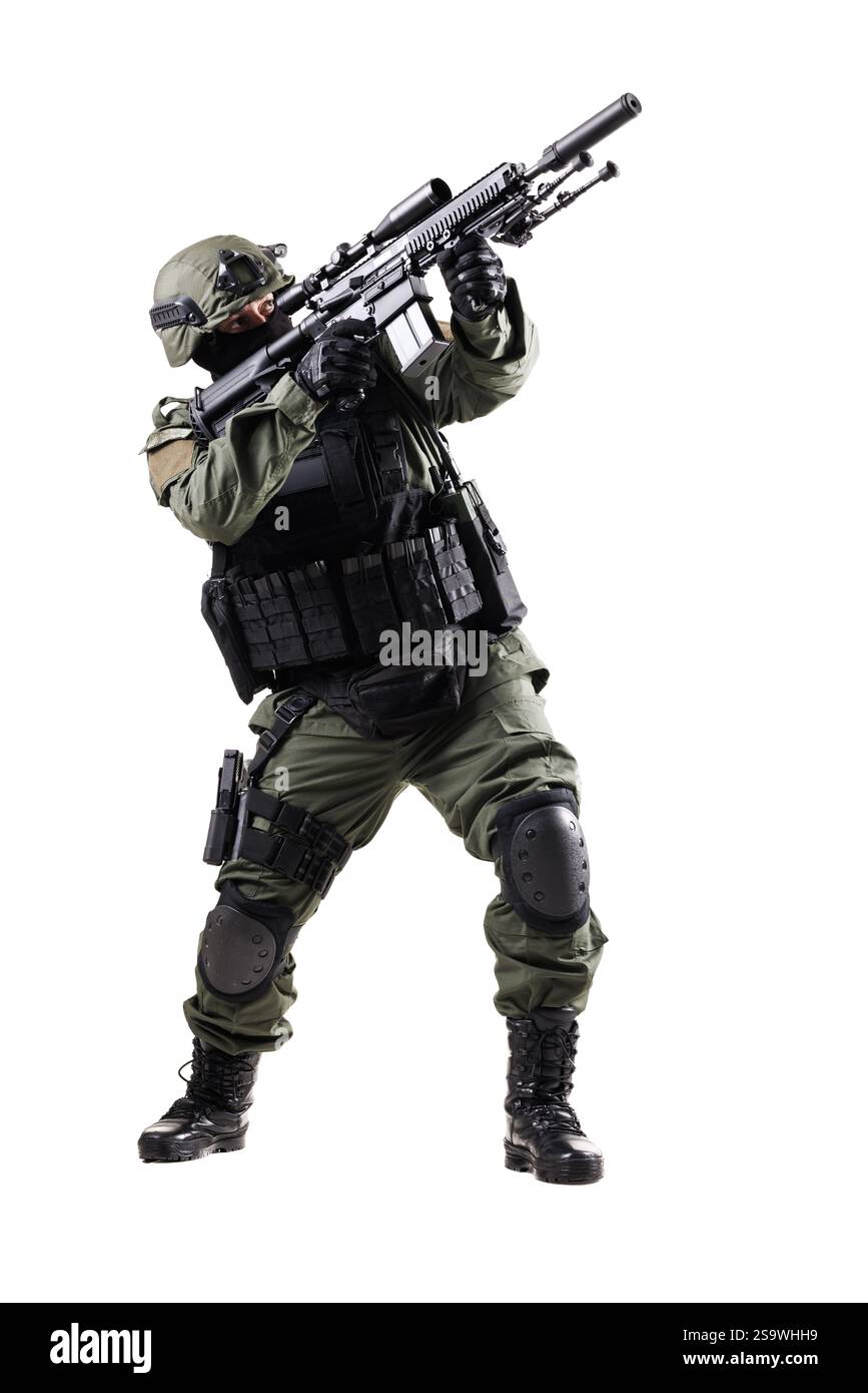 Military officer in full uniform carrying a firearm and positioned in a ...