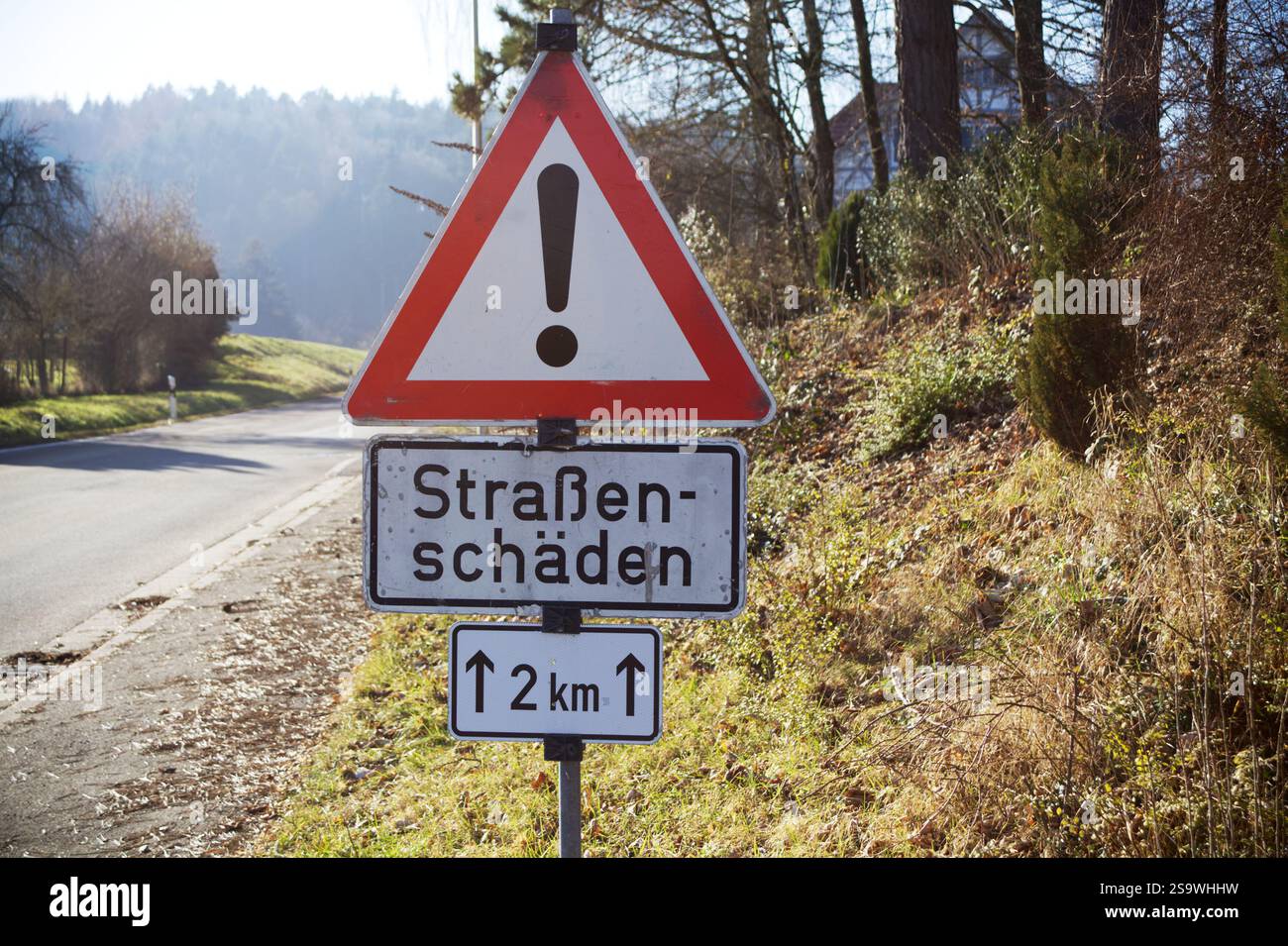 Traffic sign warning of road damage alerts drivers to danger Stock ...