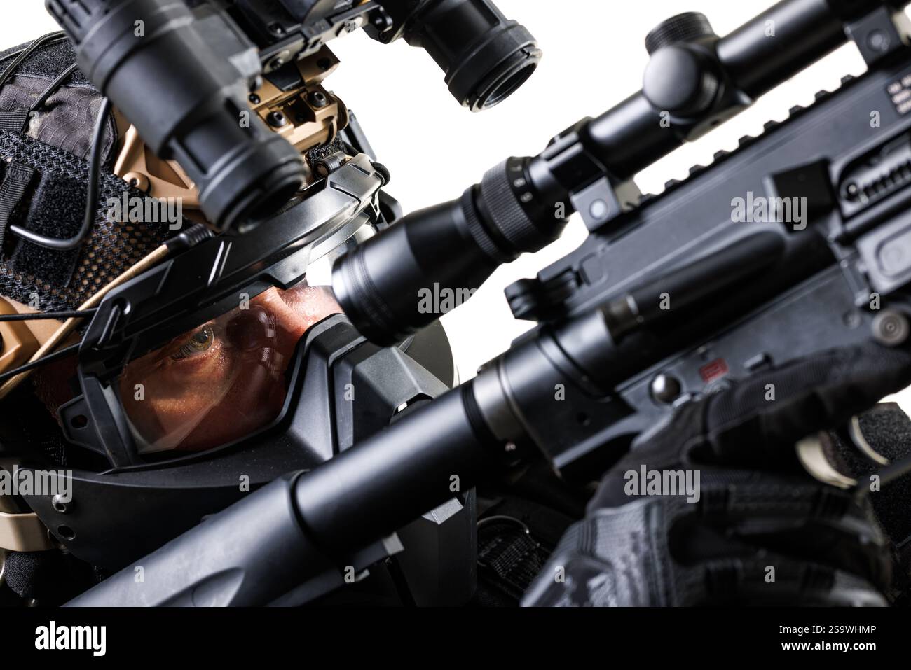 Focused tactical operator aiming their rifle equipped with scopes ...