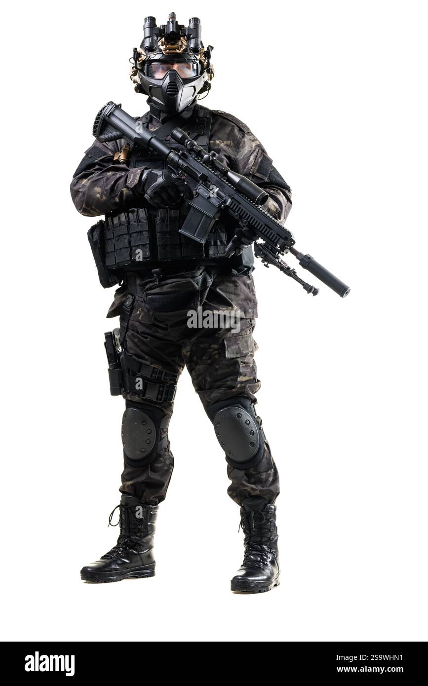 A tactical soldier in advanced combat attire and gear holding a weapon ...