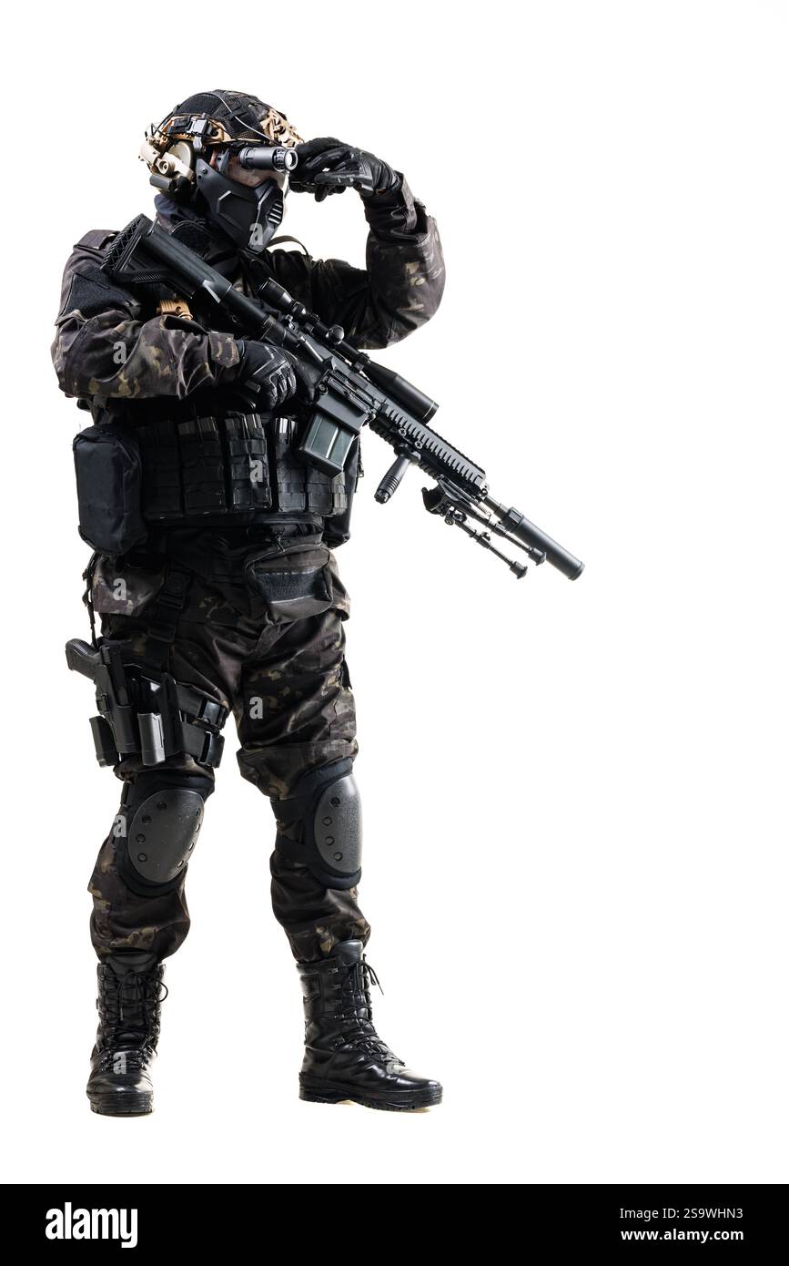 Armed soldier in full tactical gear, wearing camouflaged uniform ...