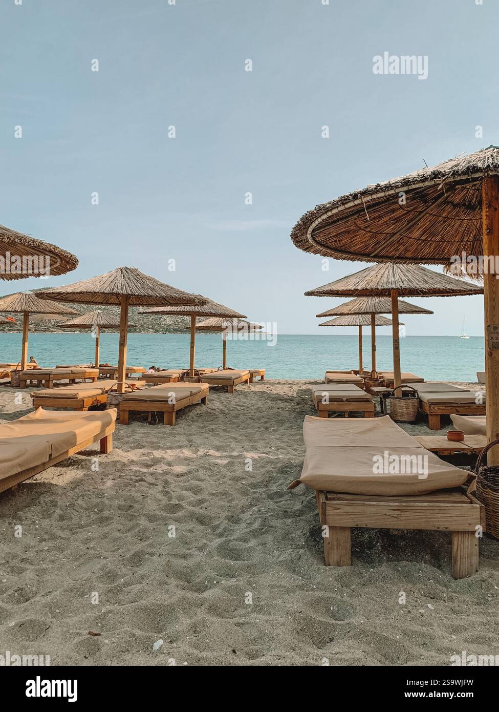 Relaxing photograph of beach seats set up on Charakas Beach, Greece ...