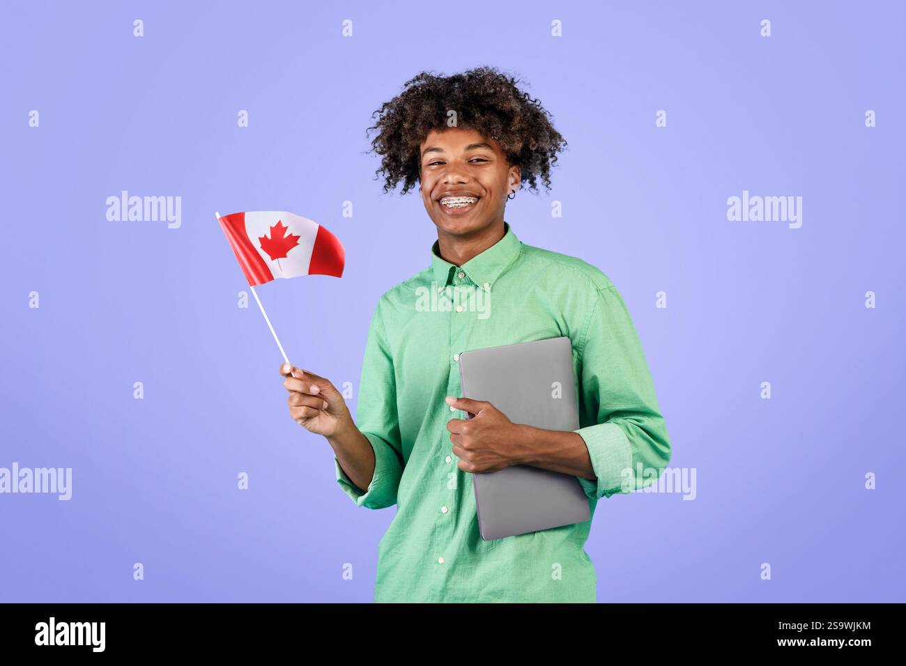 Modern education and student exchange. Happy black guy with laptop ...
