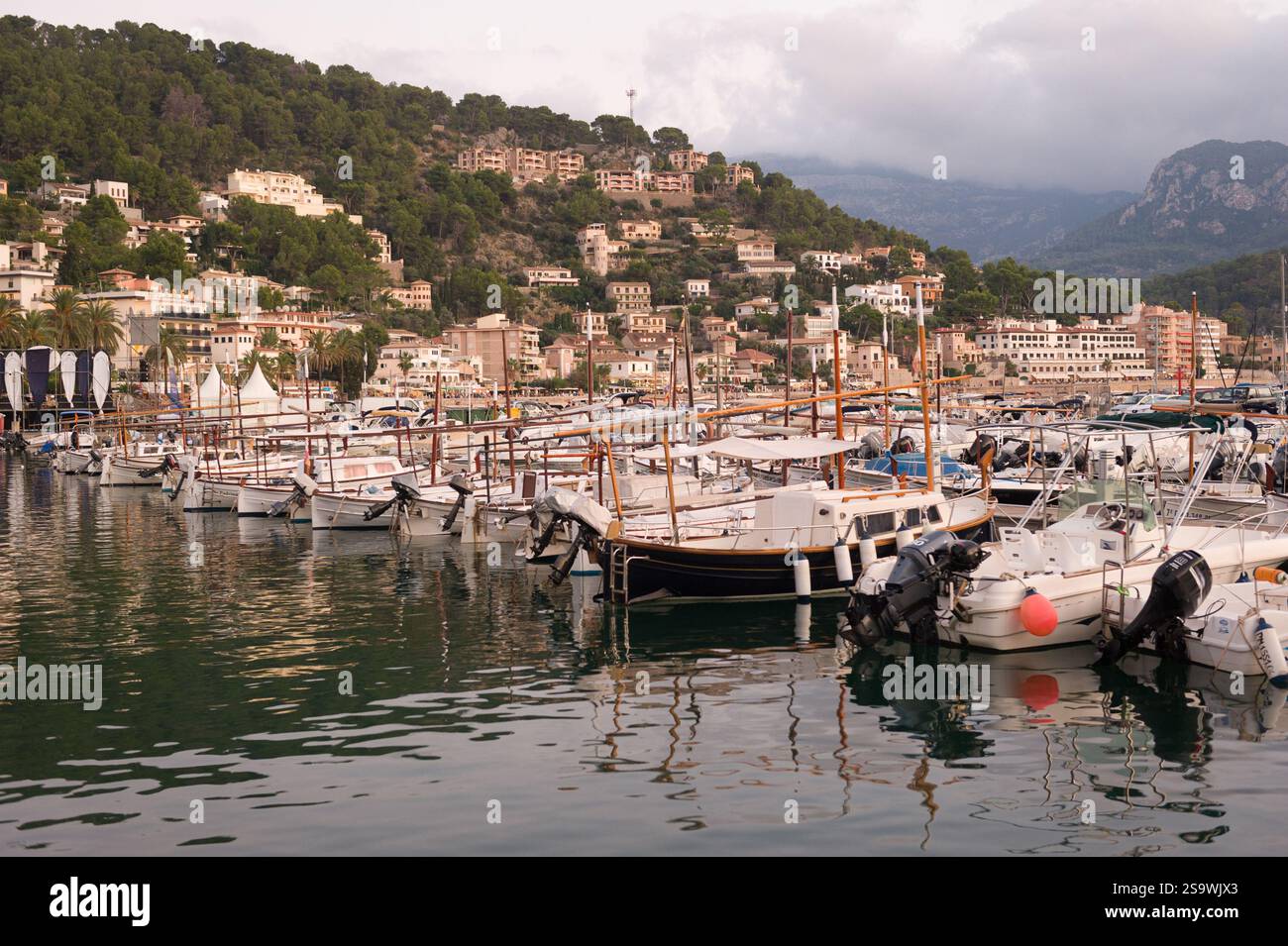 Port Town with Sailboats and a Mountainous Background Stock Photo - Alamy