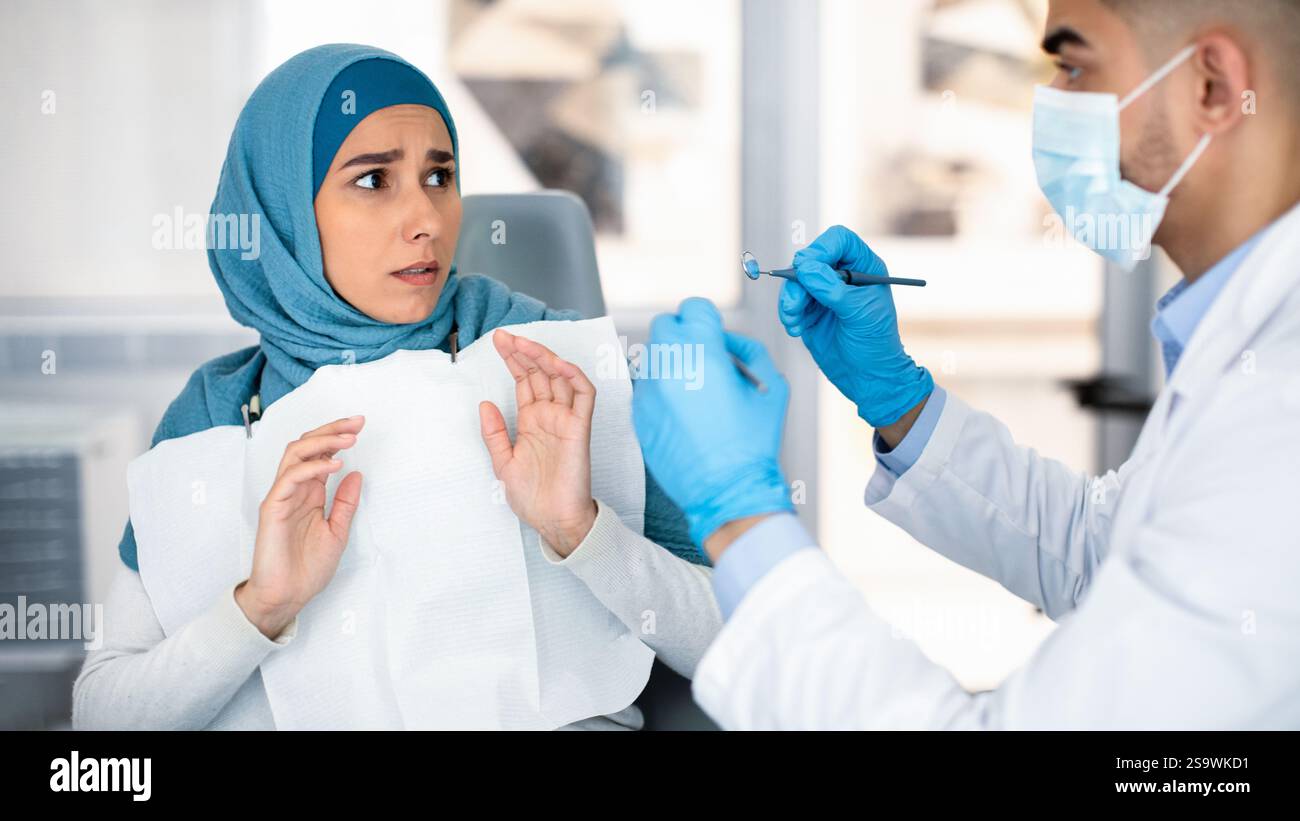 Dental Care In Islam. Portrait Of Scared Muslim Lady At Stomatologic ...