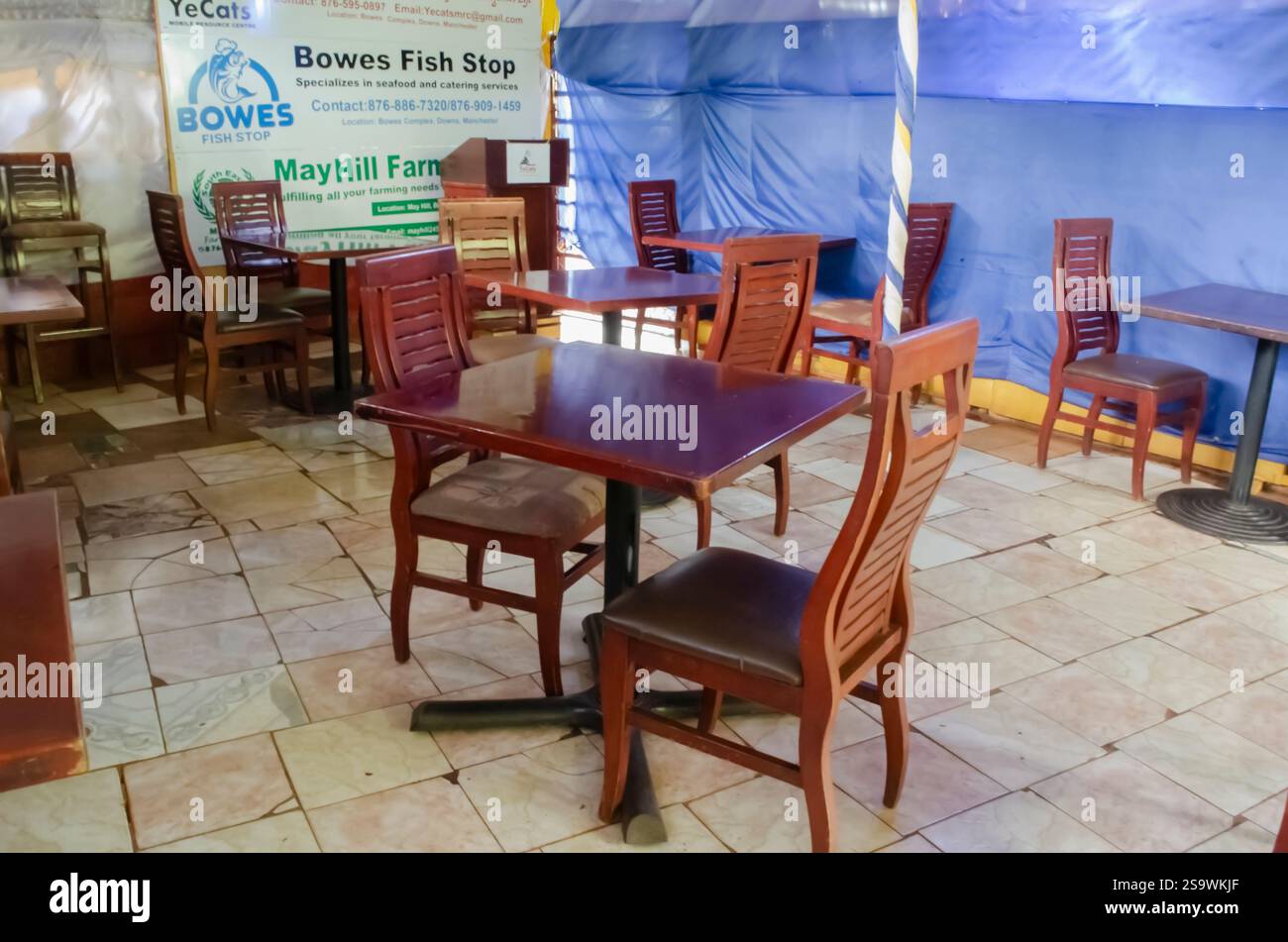 Chairs and Tables In a Semi-indoor Restaurant Stock Photo - Alamy