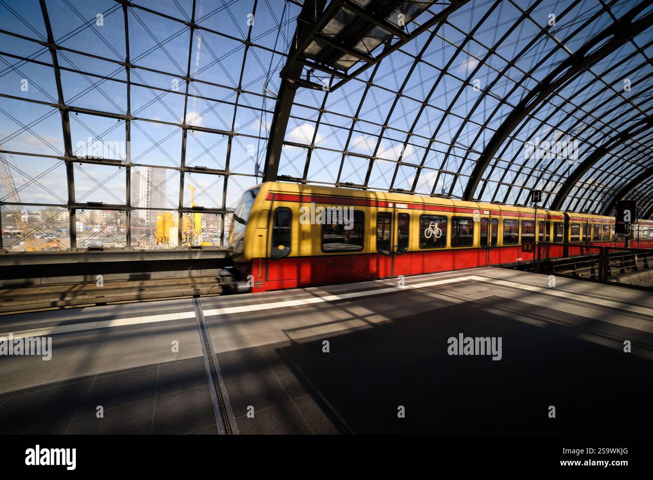 Train in Motion at a Modern Glass Train Station Stock Photo - Alamy