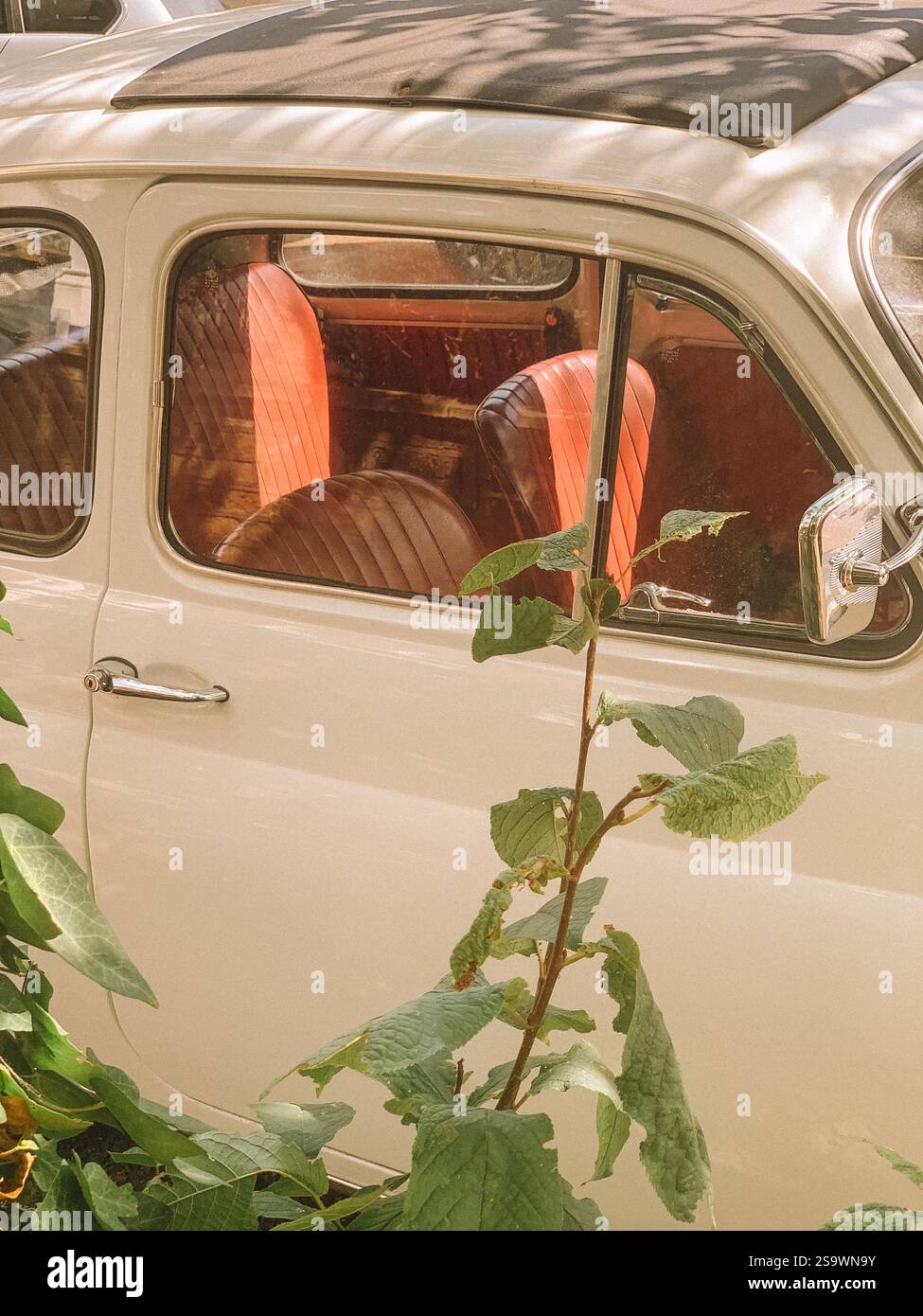 A close-up shot of a vintage car, showcasing its classic design and ...
