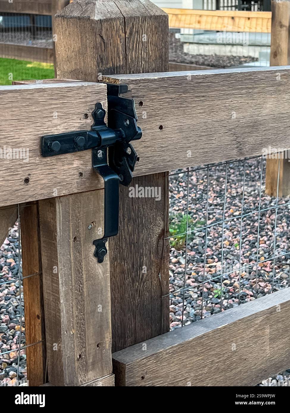 Split rail fence installation with wire mesh Stock Photo - Alamy