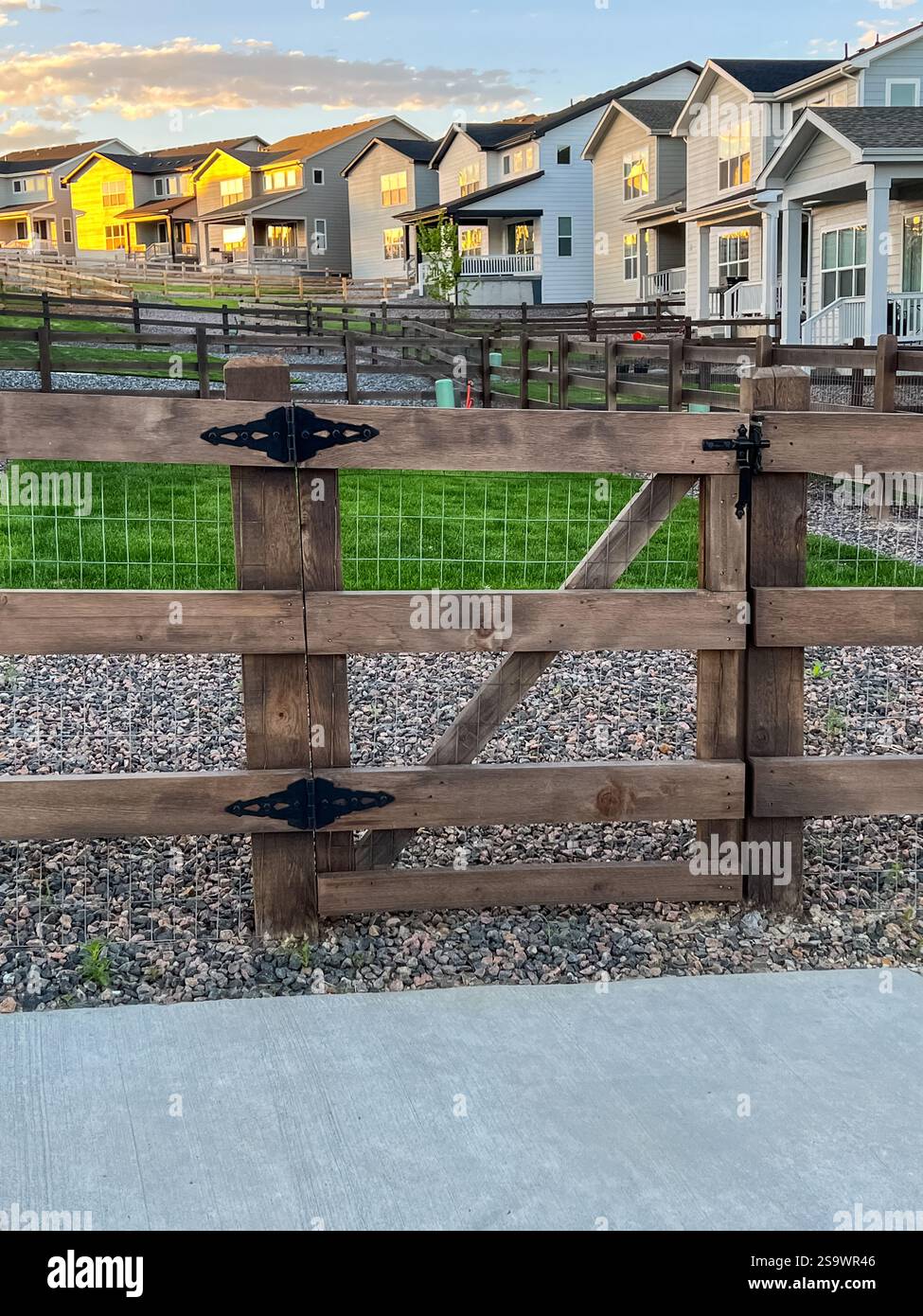 Split rail fence installation with wire mesh Stock Photo - Alamy