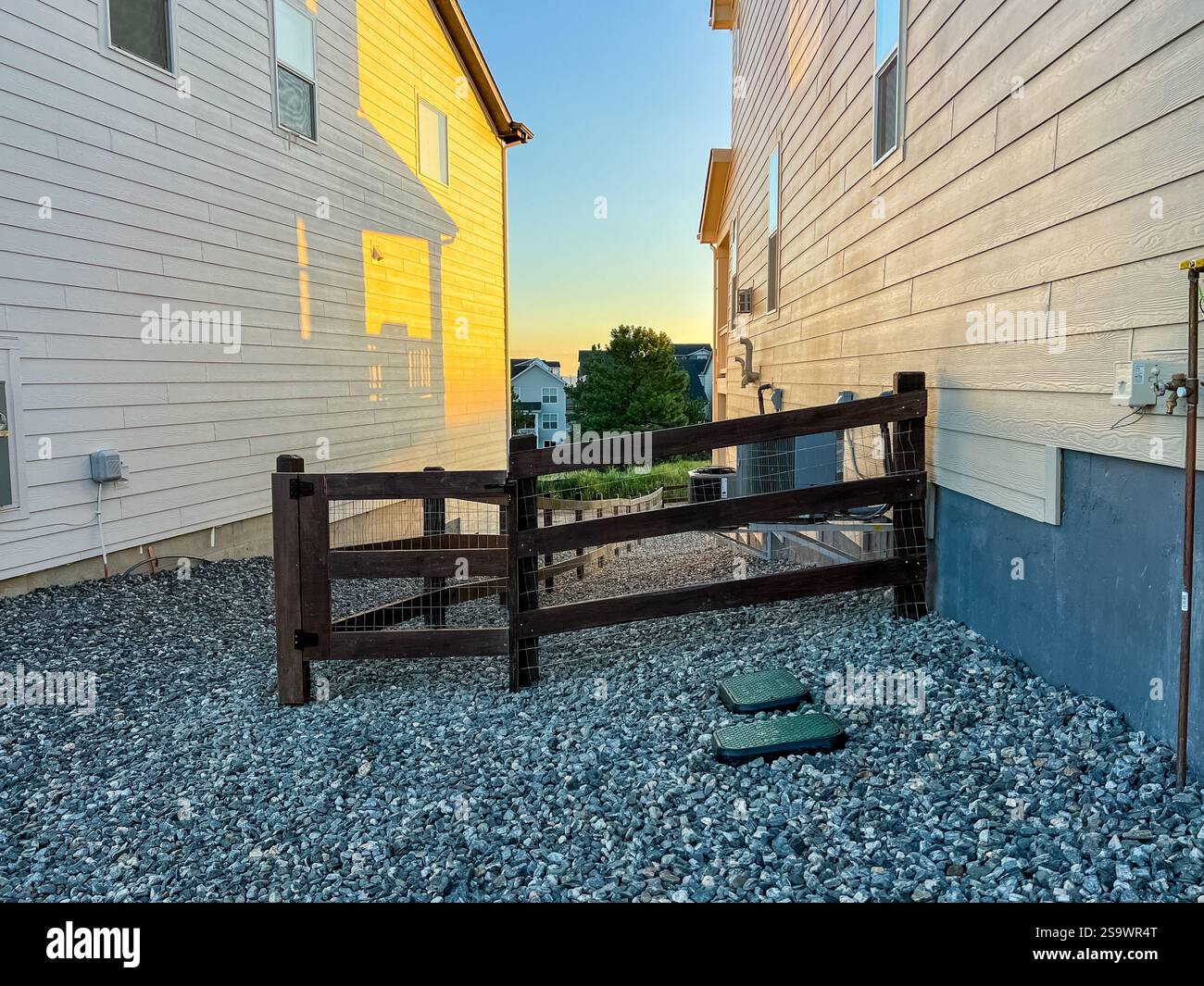 Split rail fence installation with wire mesh Stock Photo - Alamy