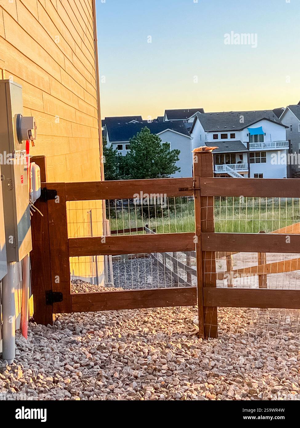 Split rail fence installation with wire mesh Stock Photo - Alamy